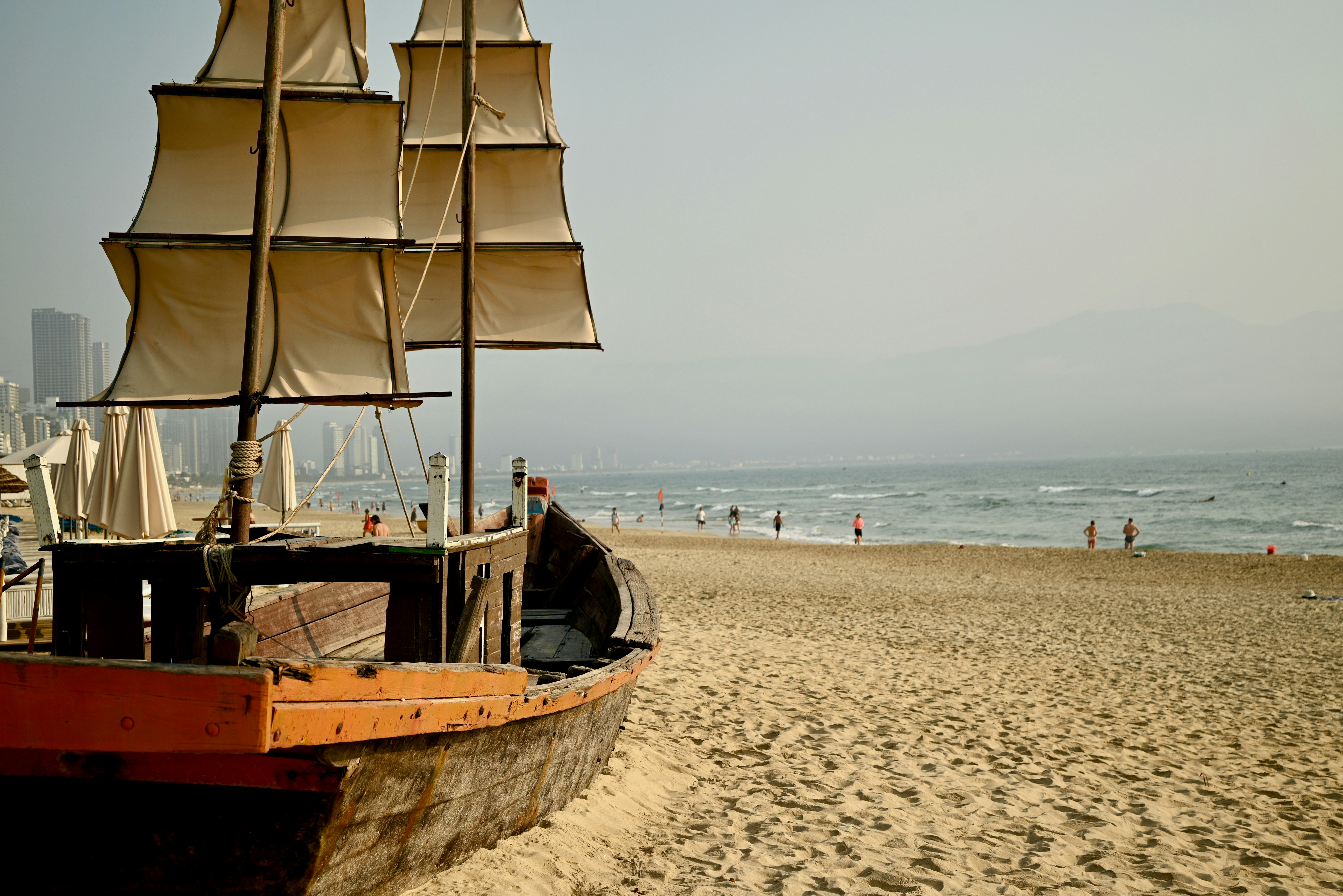 Ashore Galleon: Weathered hull and sails anchor a quiet beach scene
