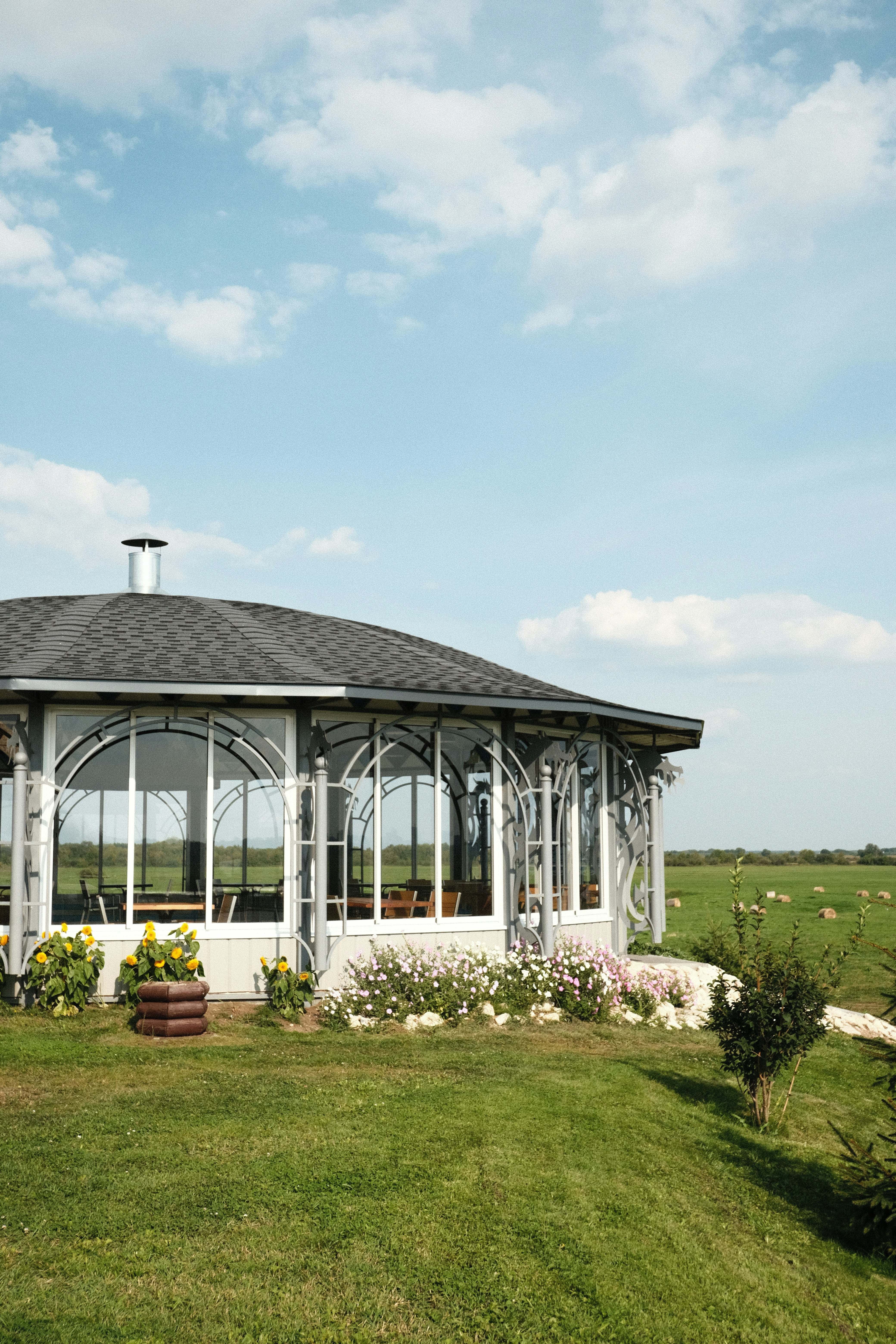 Glass-Arched Pavilion in a Quiet Rural Garden