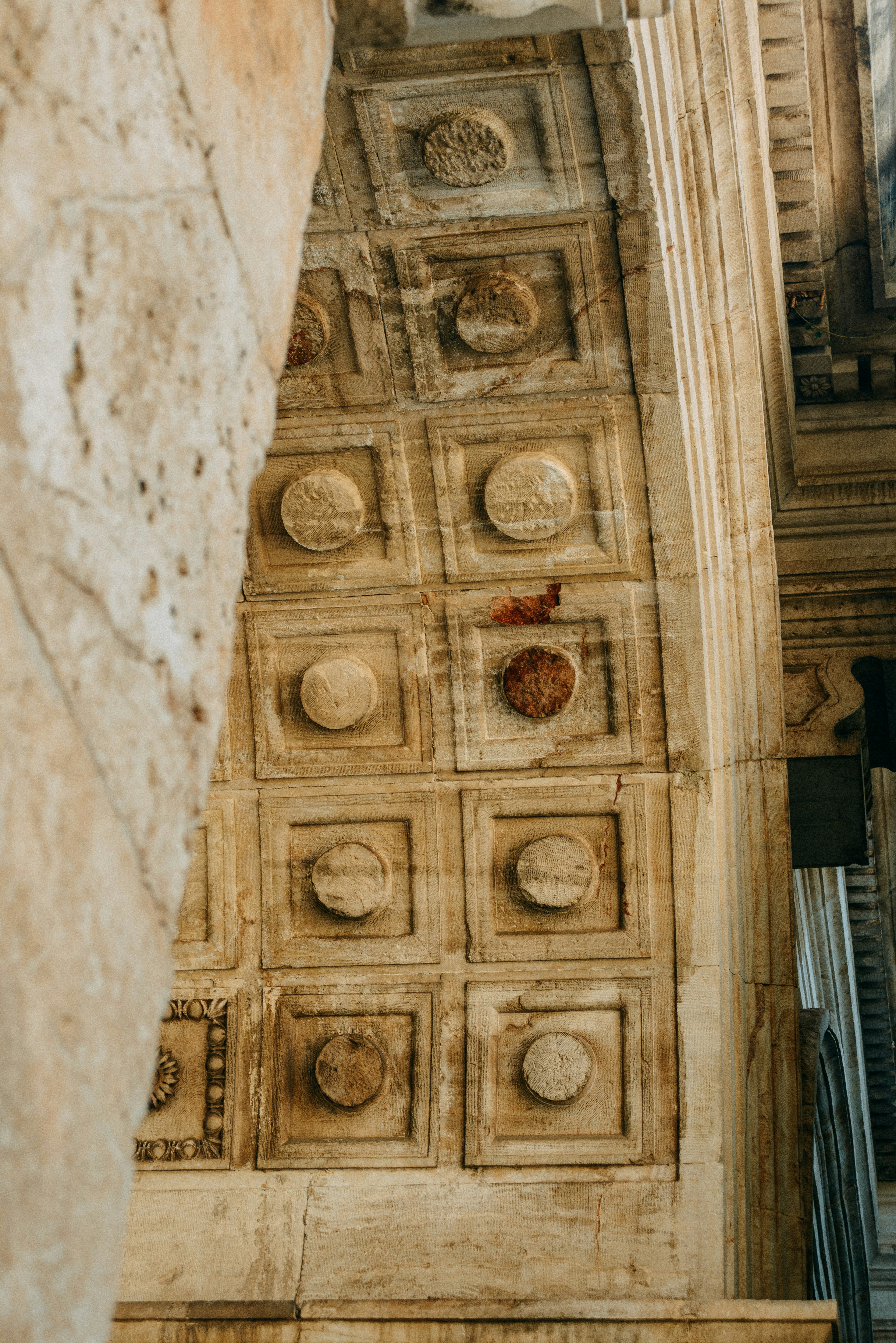 Geometric Echoes in Weathered Stone: The Recessed Coffers of an Archway