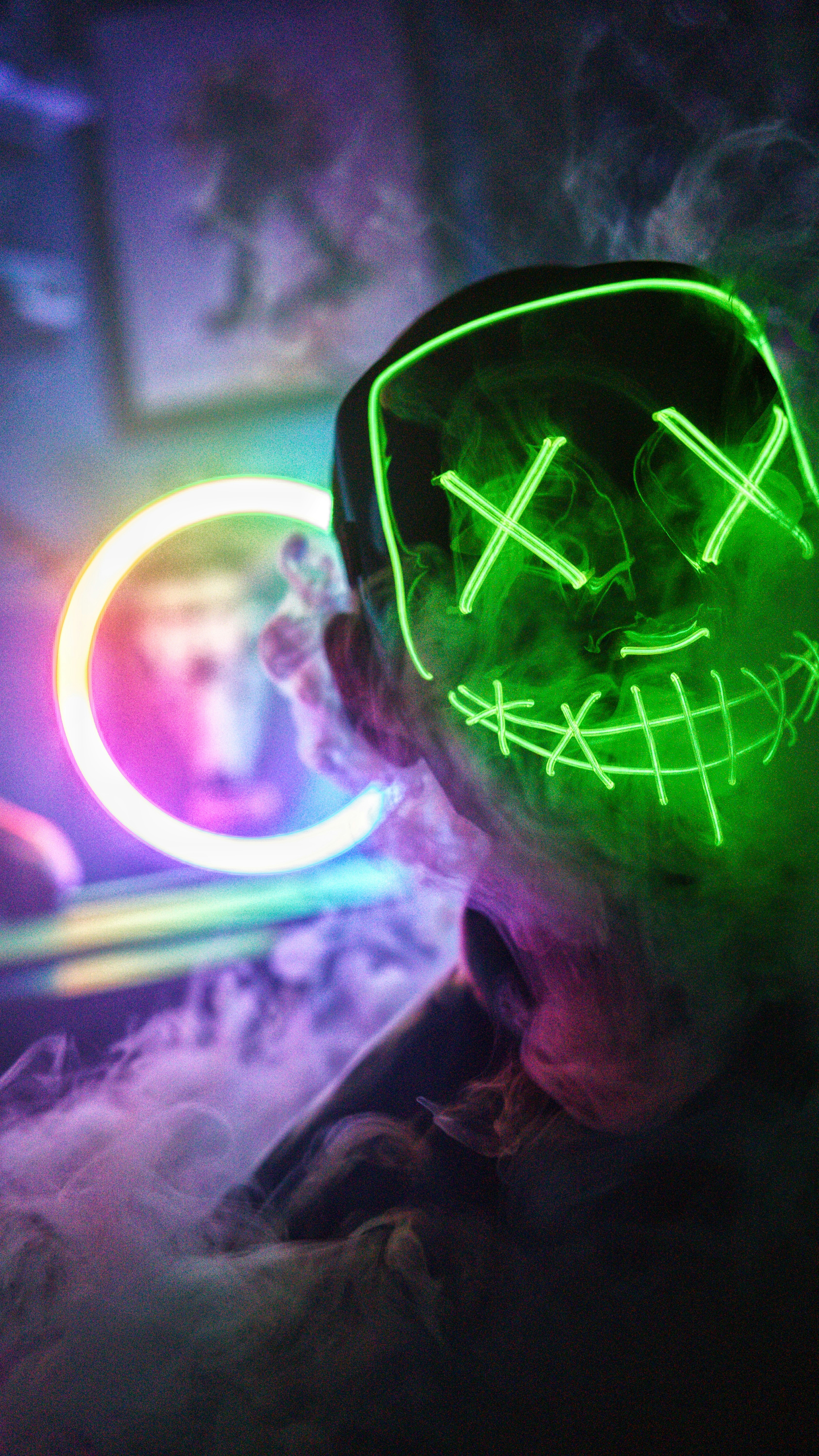 X-Eyed Neon Mask in a Smoke-Swirled Neon Night