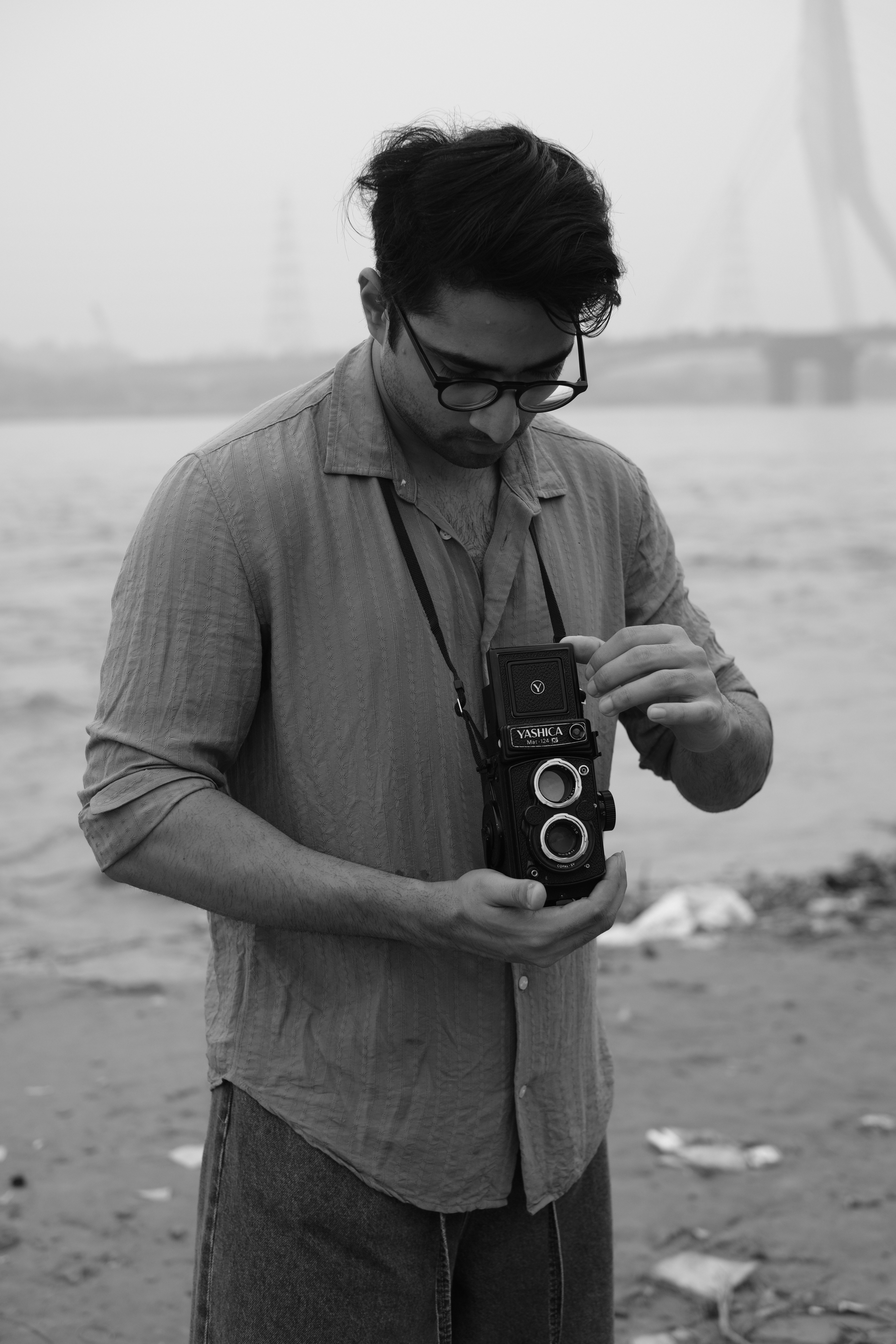 Riverbank Quiet: A Portrait with a Vintage Twin-Lens Camera