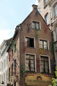 Color-Coded Cyclists: A Brick Facade Transformed into Urban Art