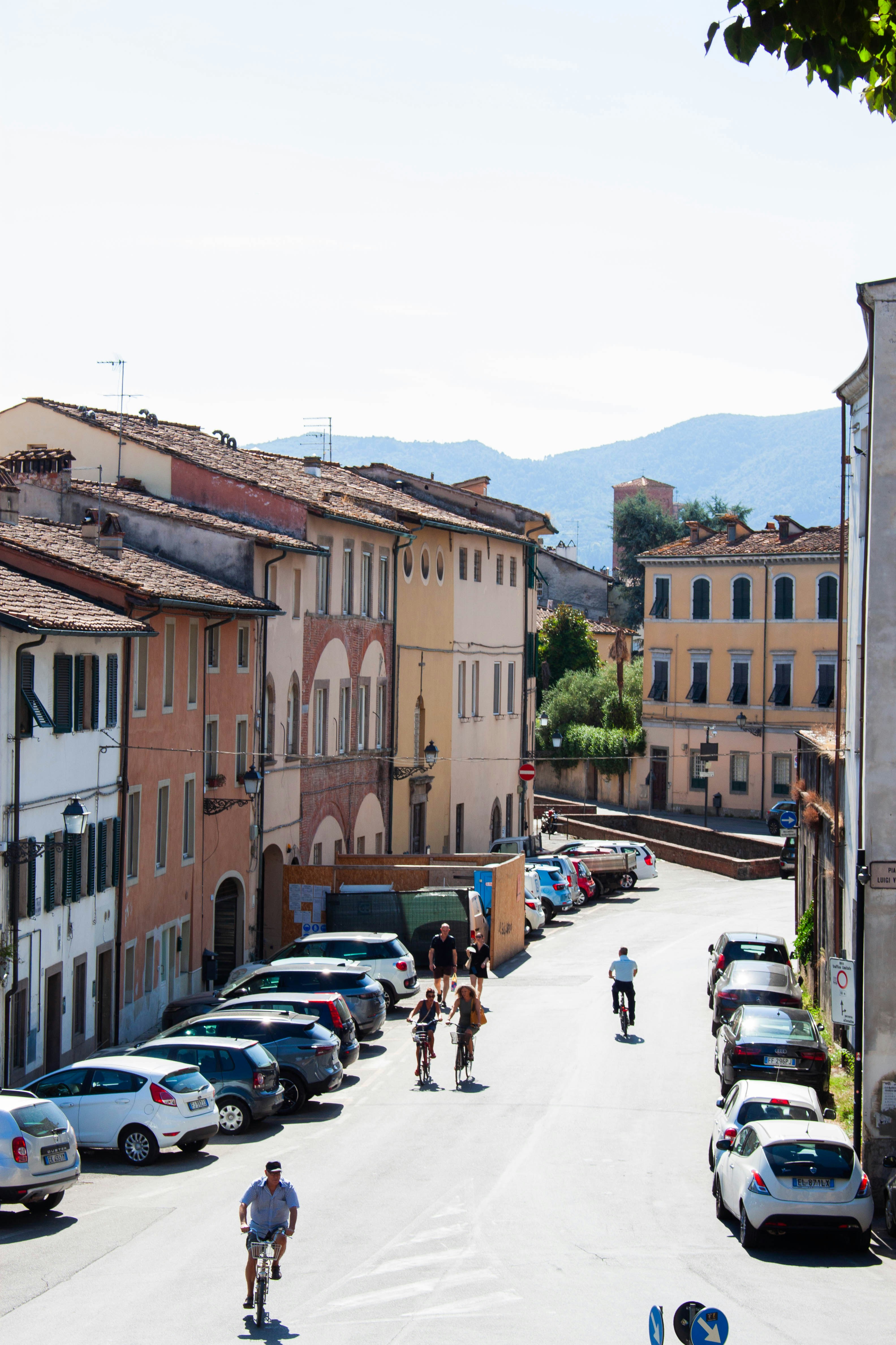 A group of people riding skateboards down a street photo – Free City ...