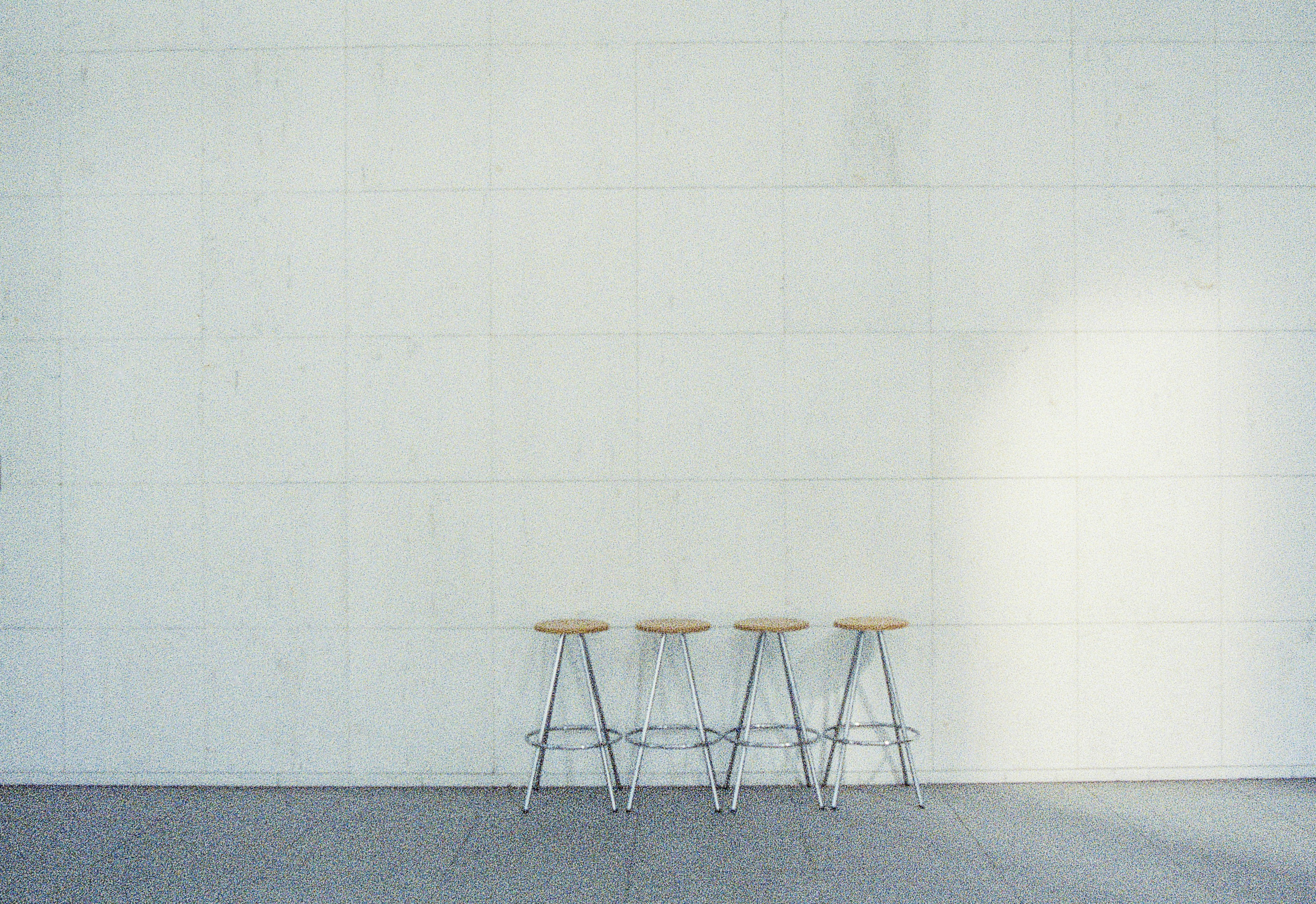 Three stools in front of a white wall photo – Free Film photography ...