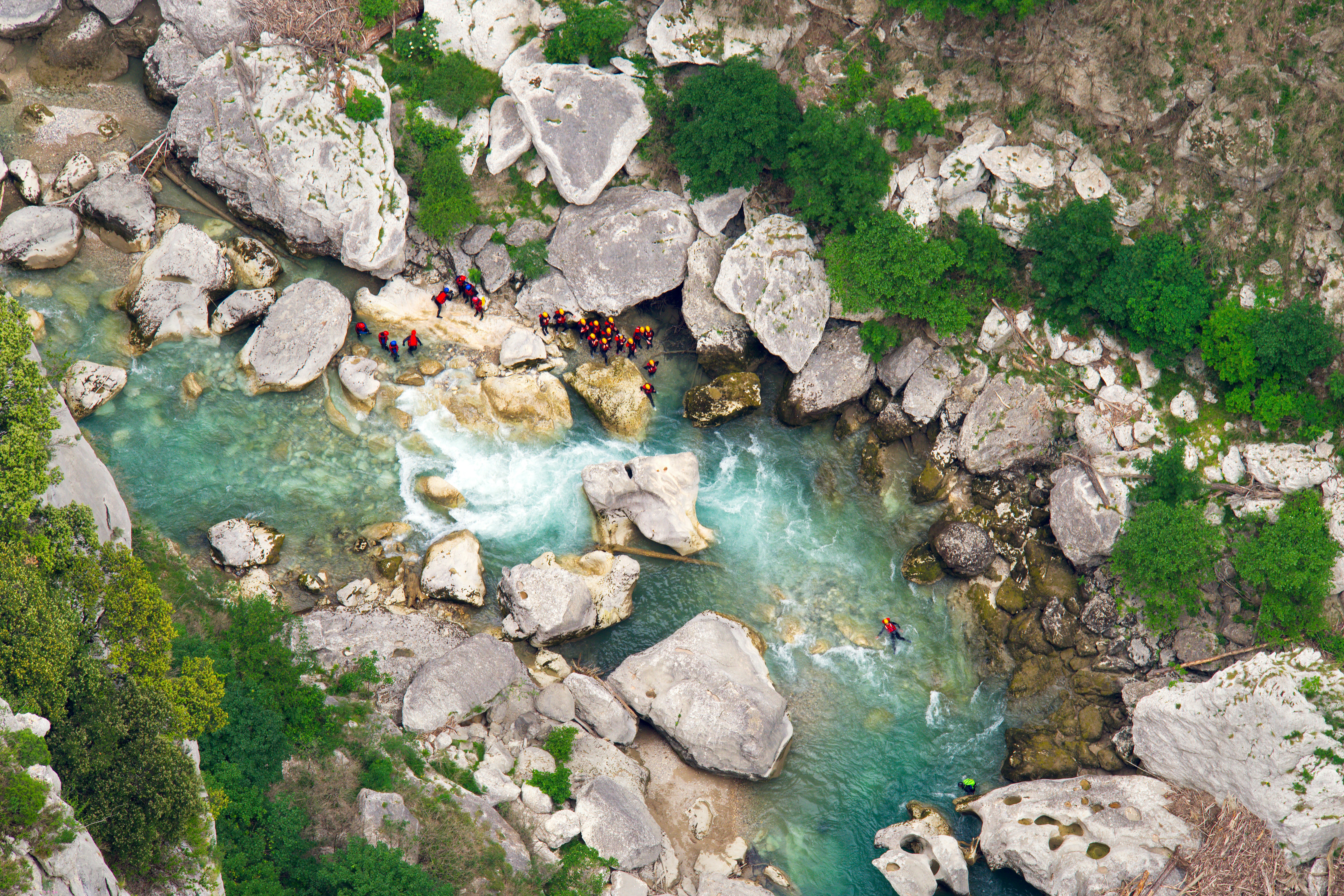 An aerial view of a river surrounded by rocks photo – Free River Image ...