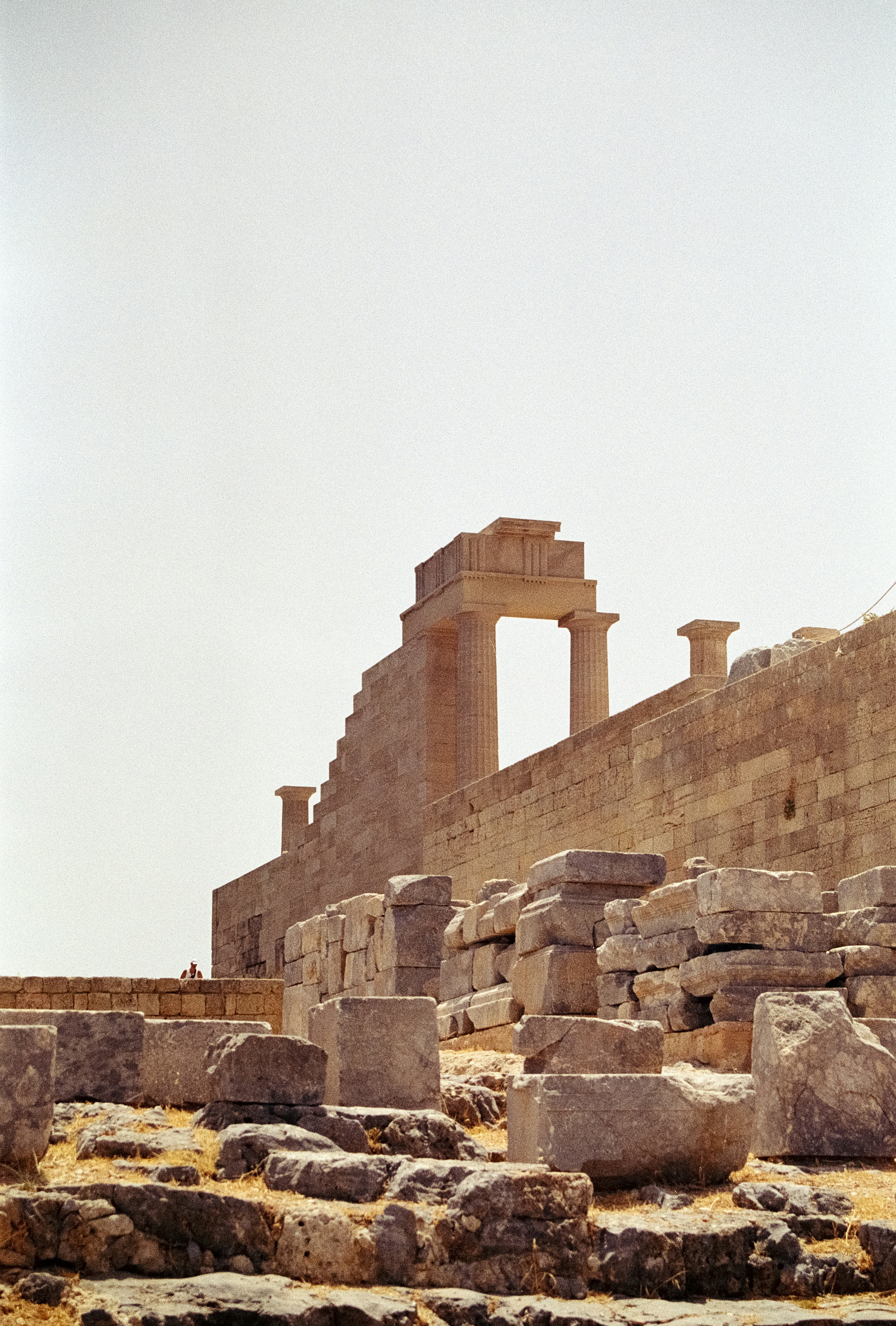 Gate of Weathered Echoes: A Columned Portal Among Ruined Stones