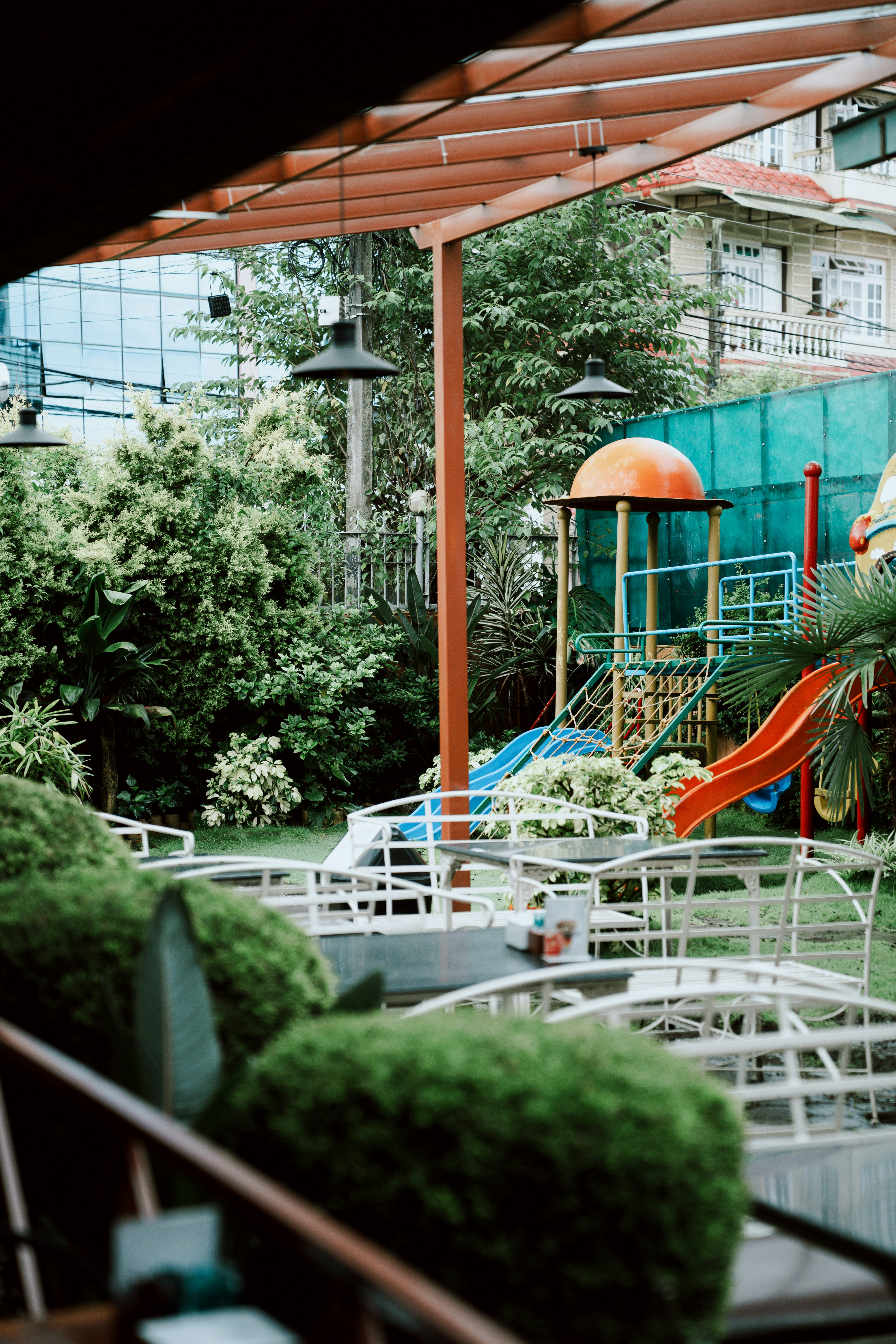 Orange-Dome Play Tower Framed by Urban Garden Canopy