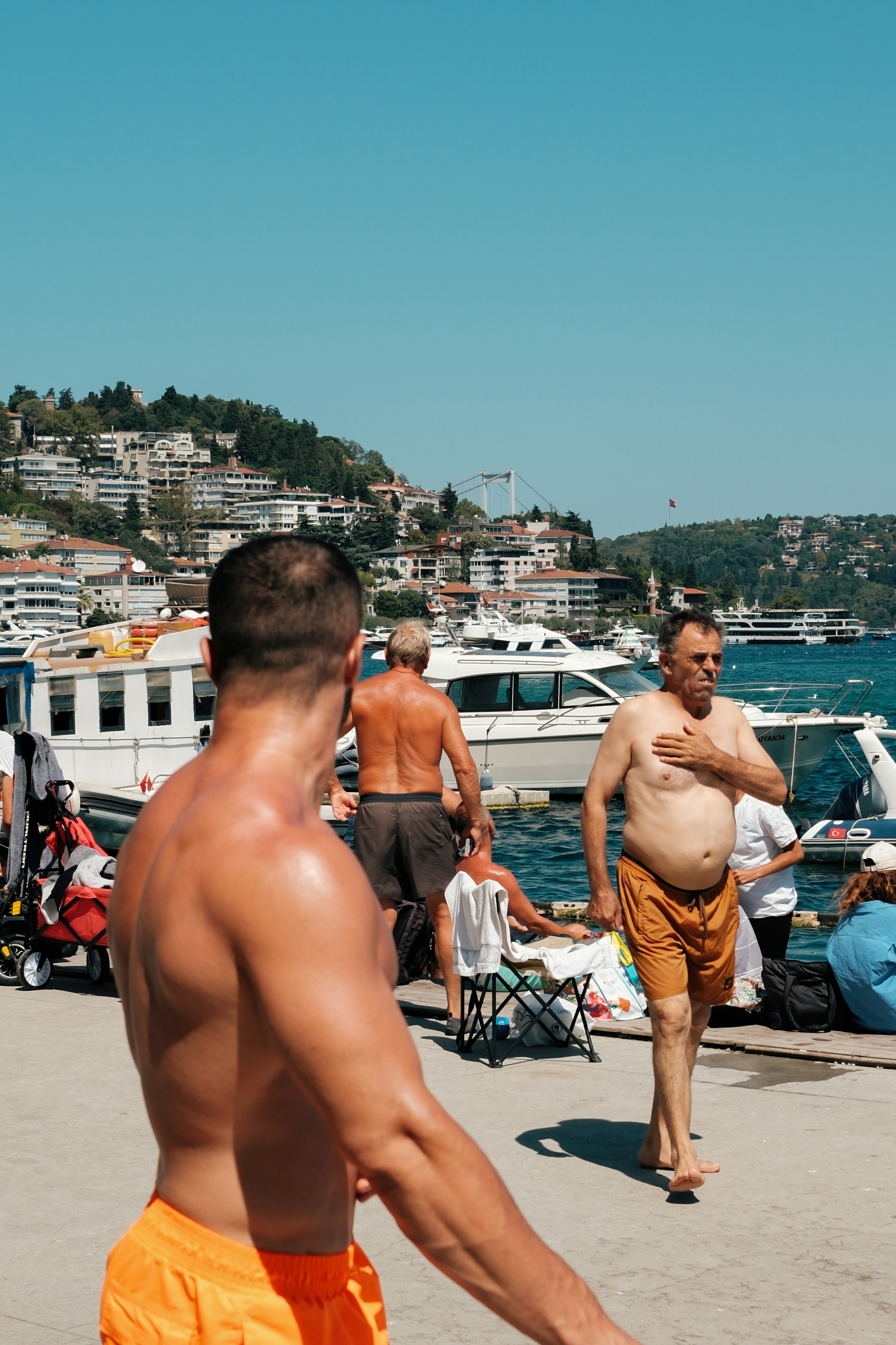 Sun-Soaked Beach Dancers: A Harbor Portrait in Warm Light
