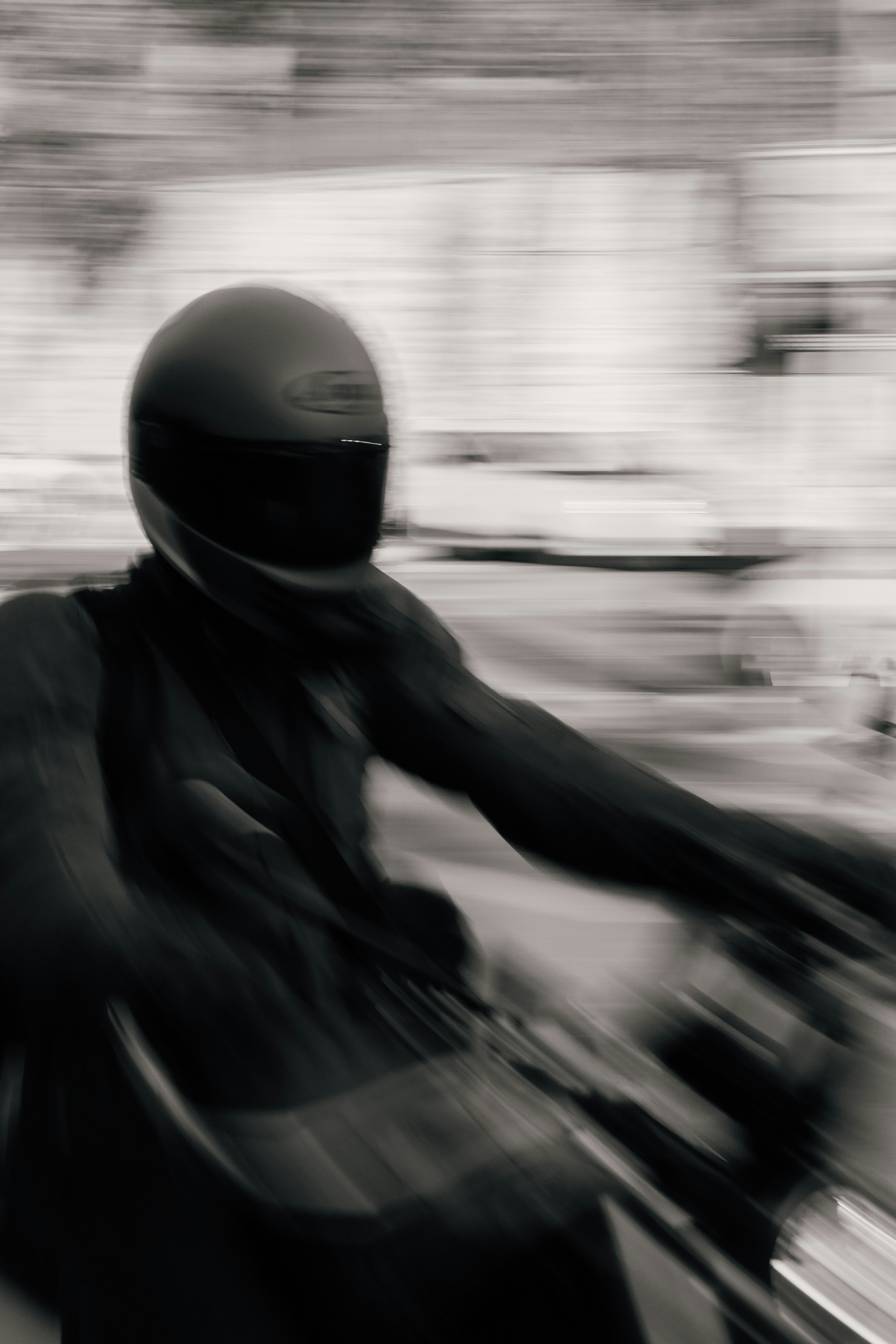 A man riding a motorcycle down a street photo – Free Man Image on Unsplash