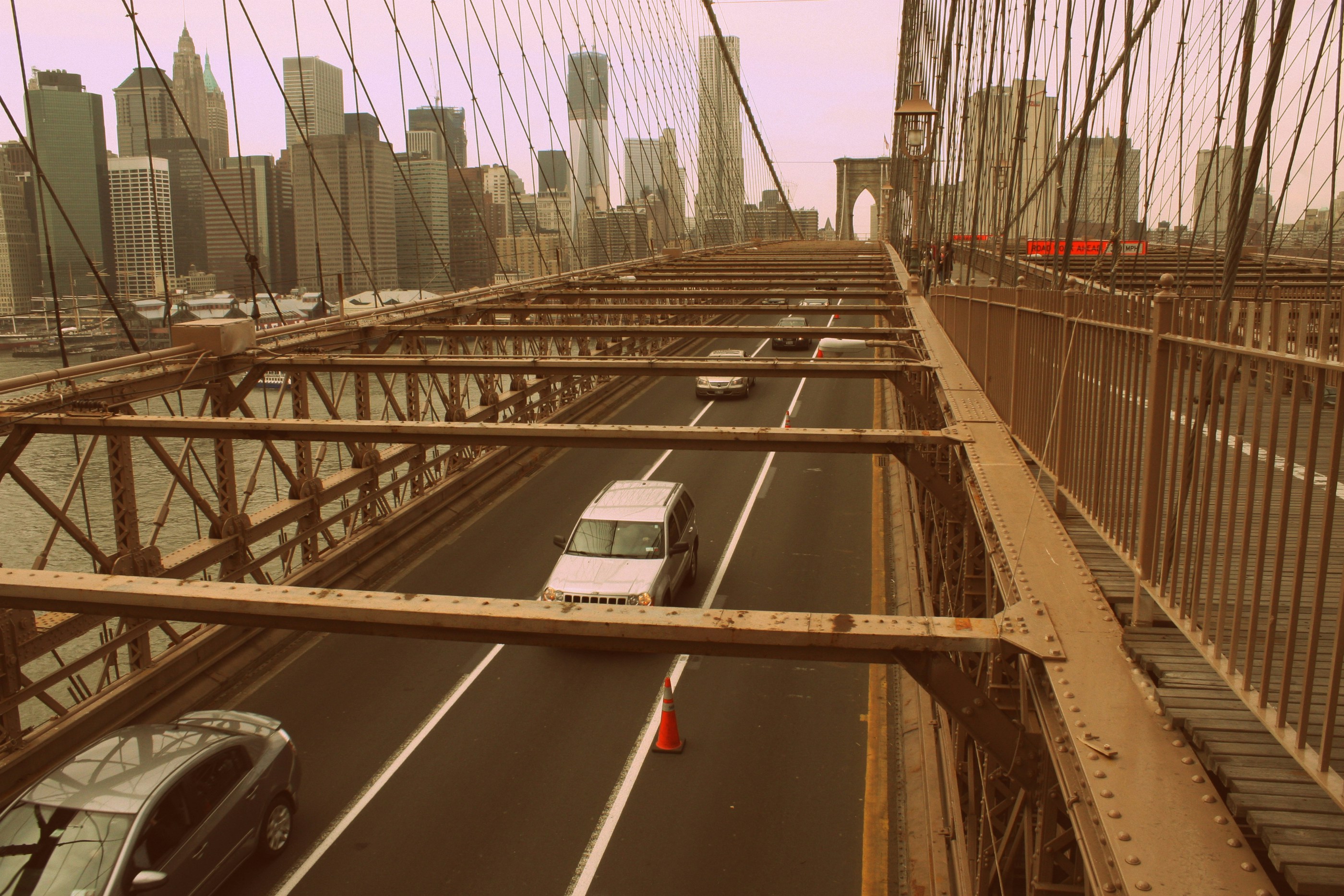 Copper Dawn on the Brooklyn Bridge: Cables, Cars, and the Manhattan Glow