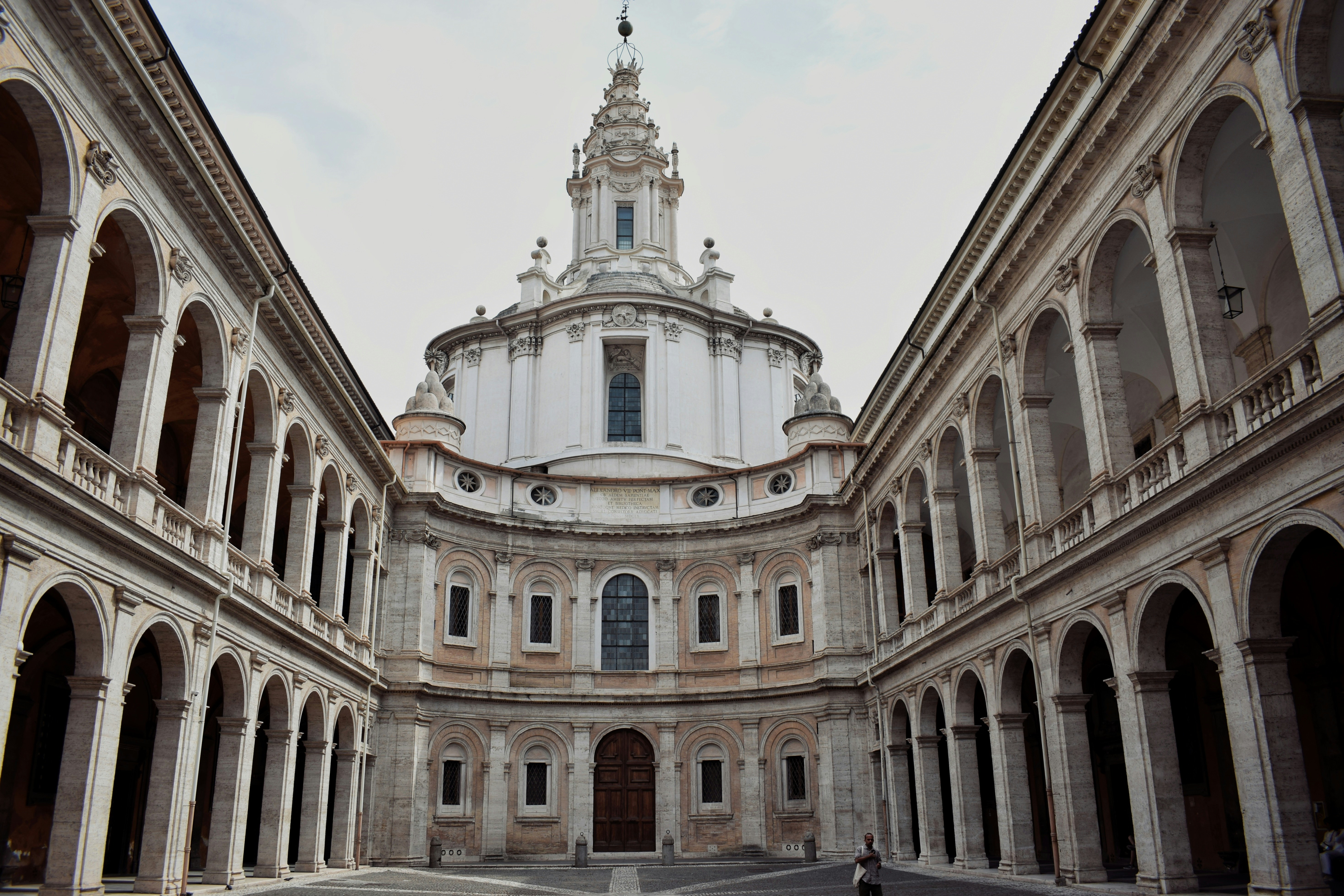 Symmetry Under Archways: Courtyard Converging on a Central Dome