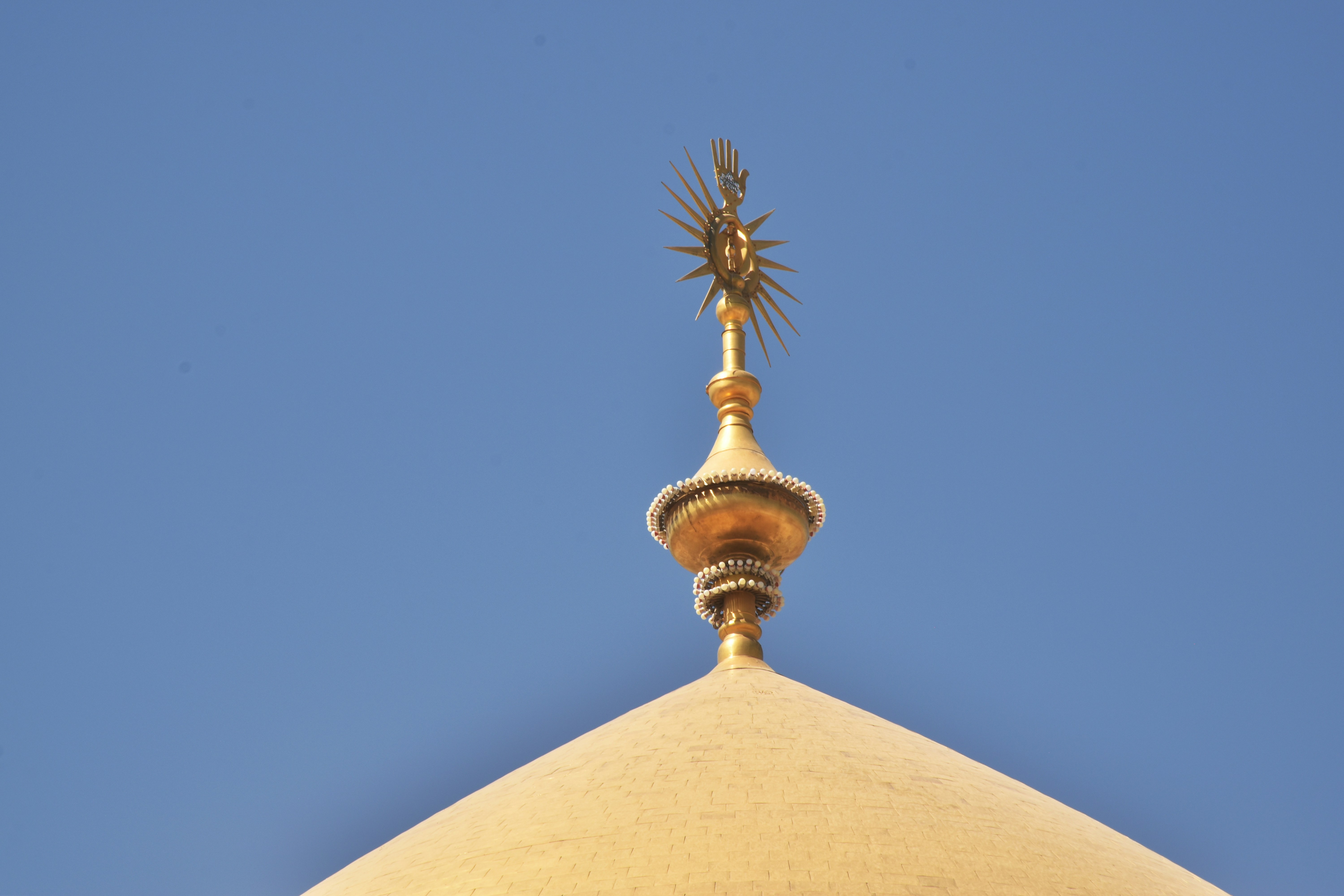 The top of a building with a clock on it photo – Free Quran Image on ...