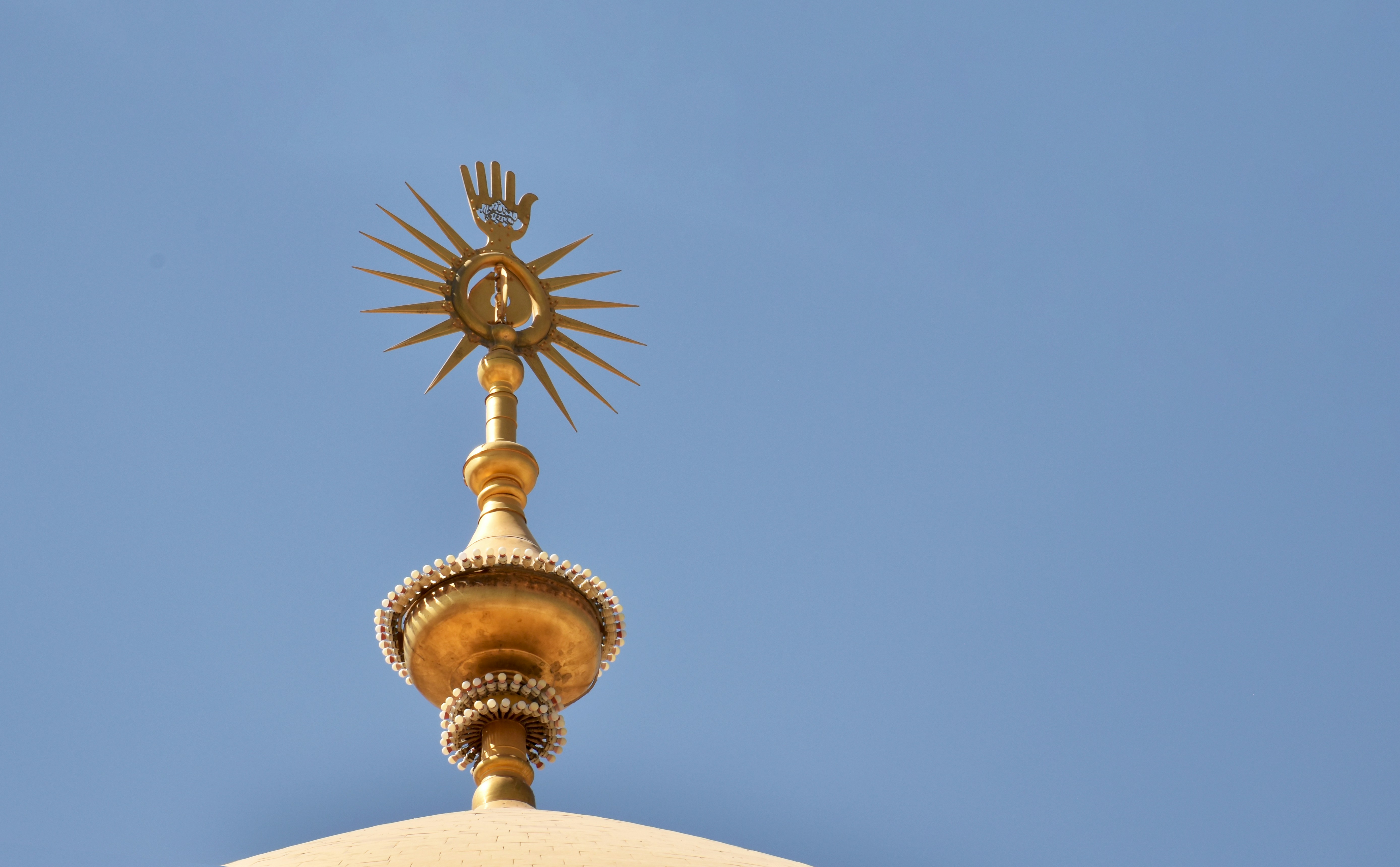 Golden Spire Against A Clear Sky