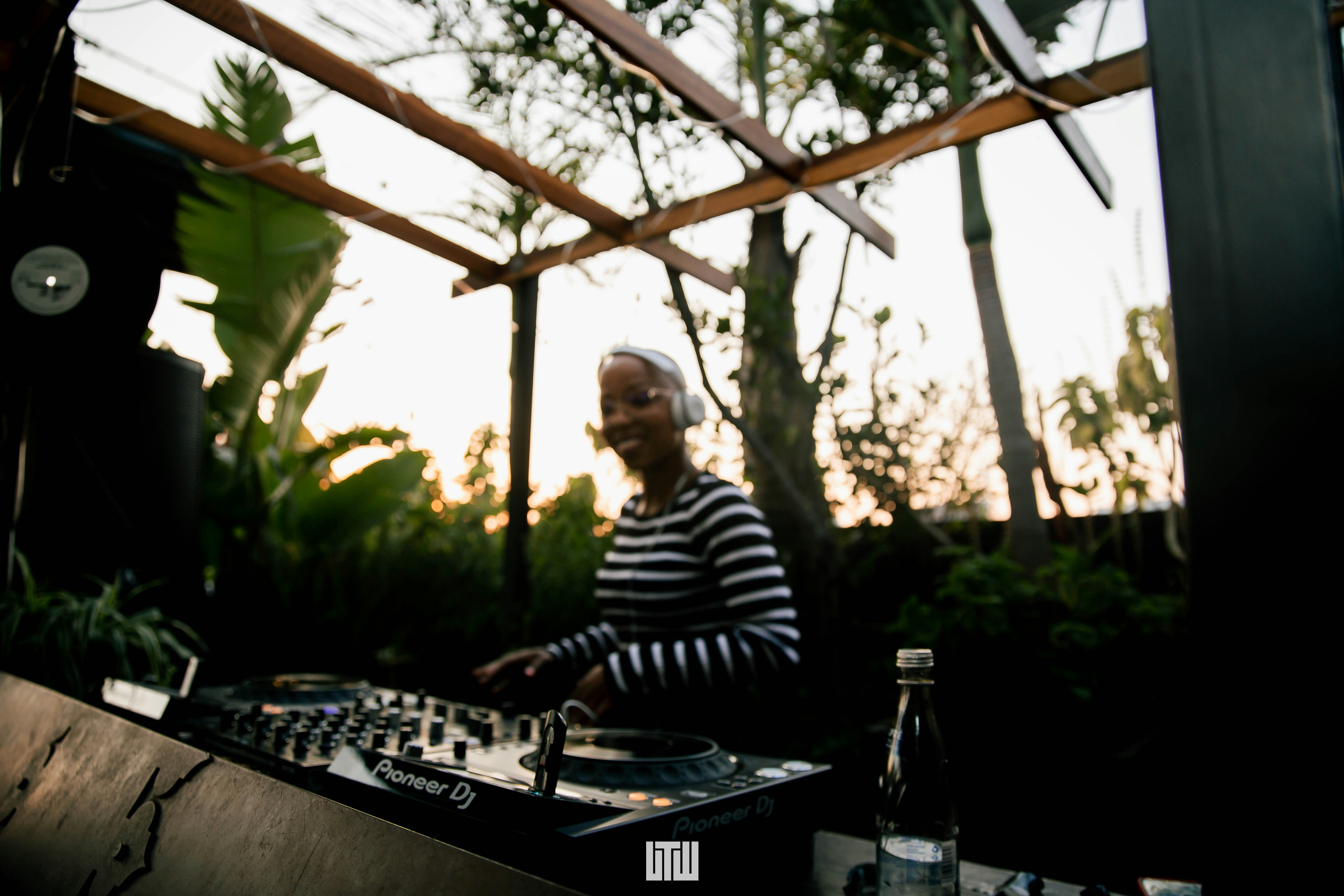 Alfresco Groove: DJ Spinning Beats on a Rustic Deck