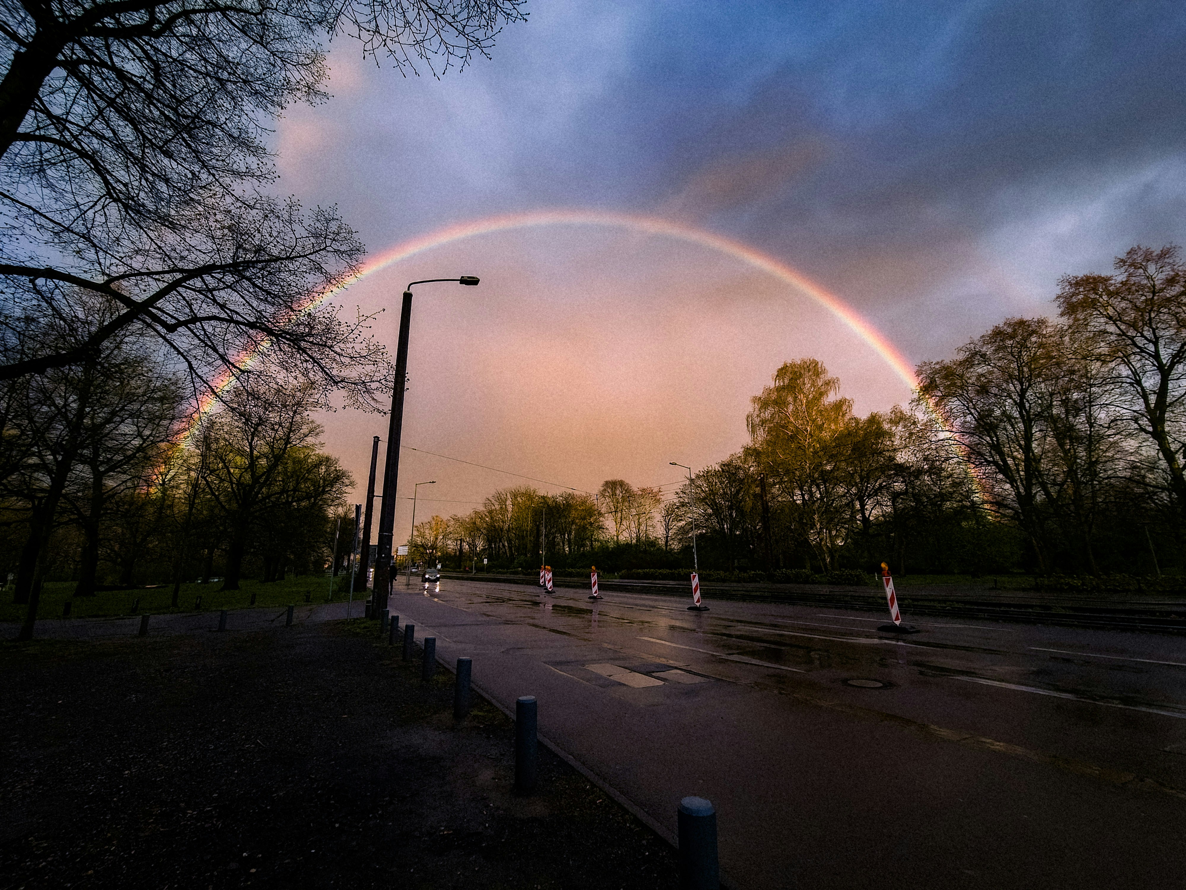 Rainbow Over a Rain-Washed Boulevard at Dusk
