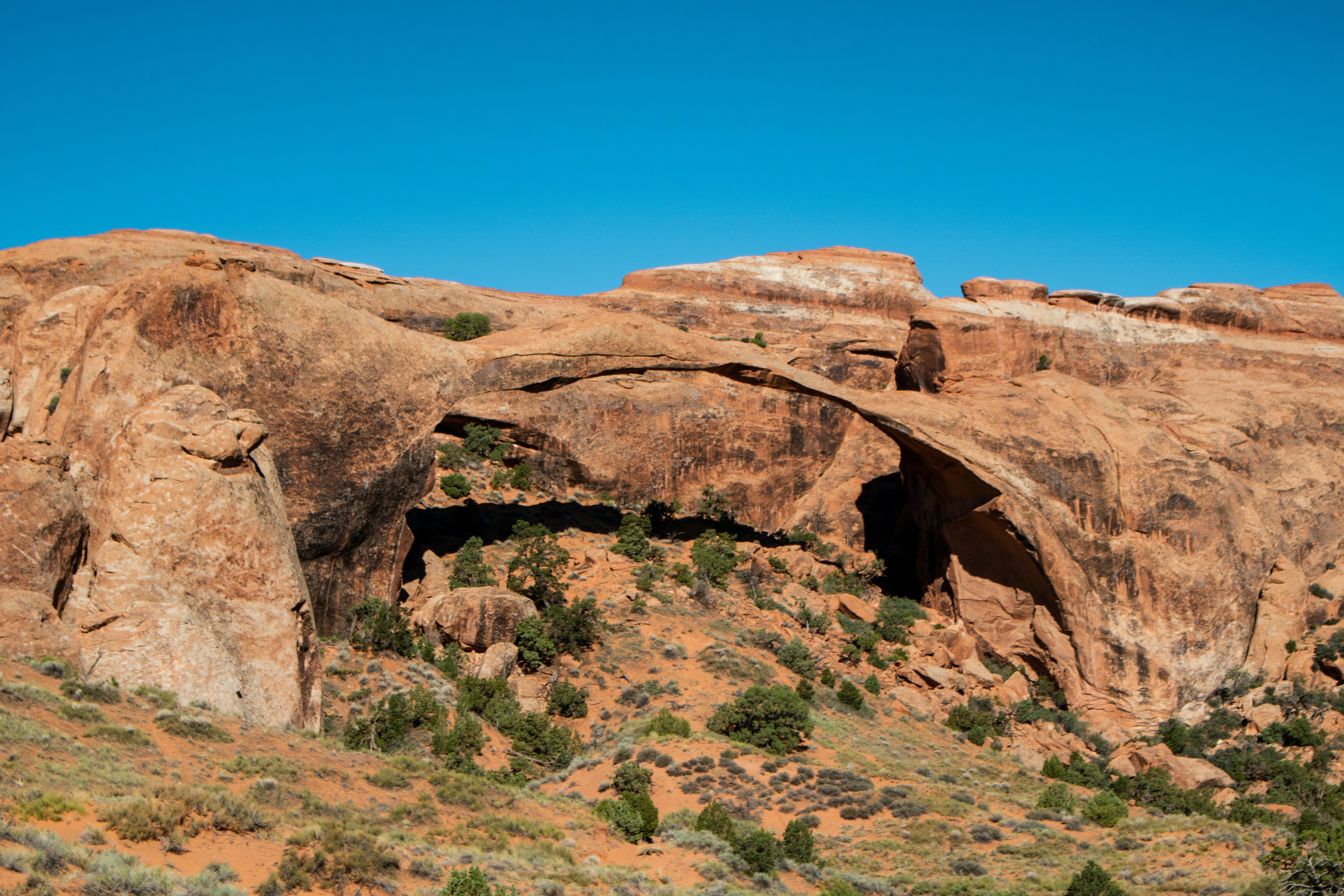Crimson Arch Over a Desert Mosaic