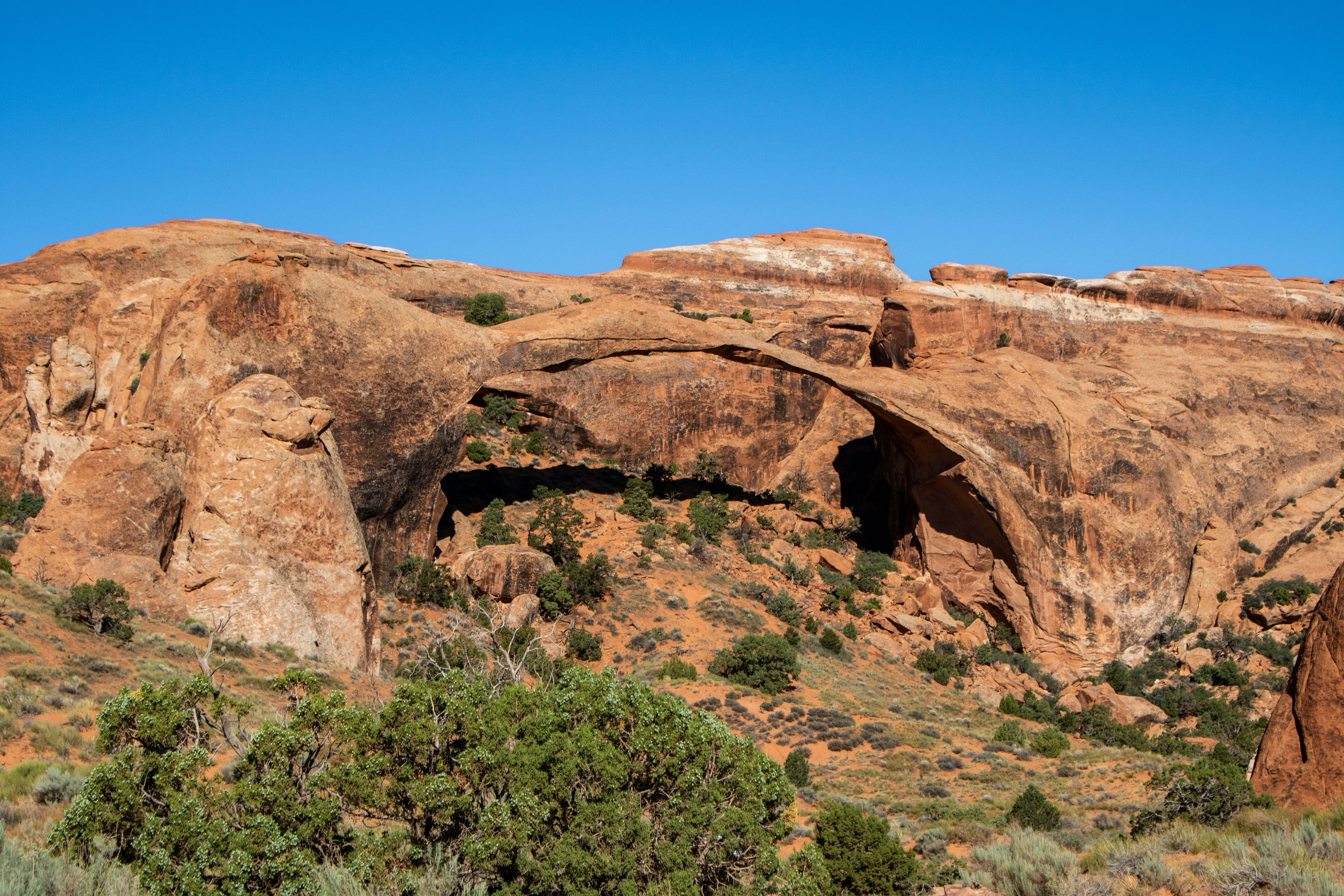 A large rock formation in the middle of a desert photo – Free Travel ...