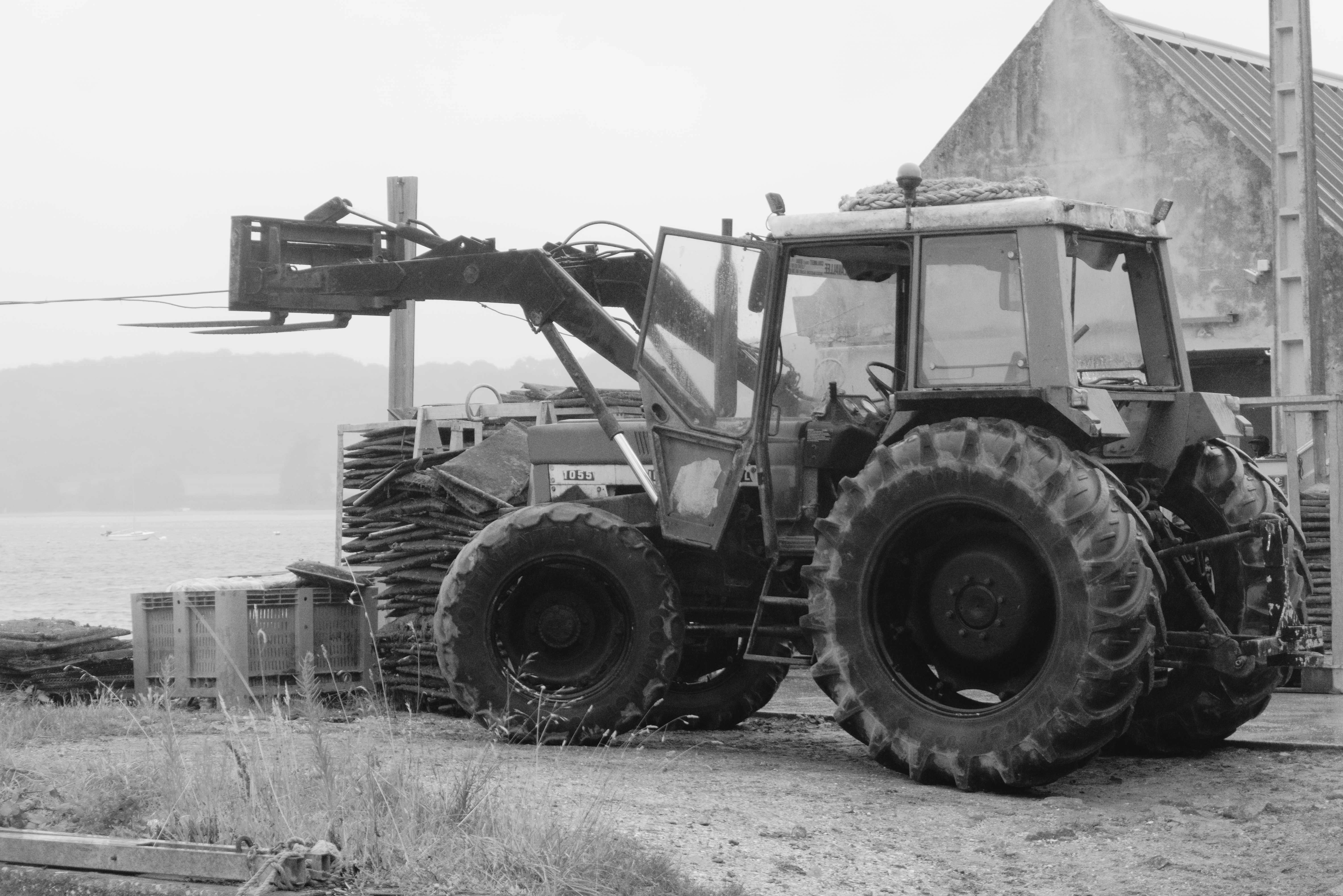 A black and white photo of a large tractor