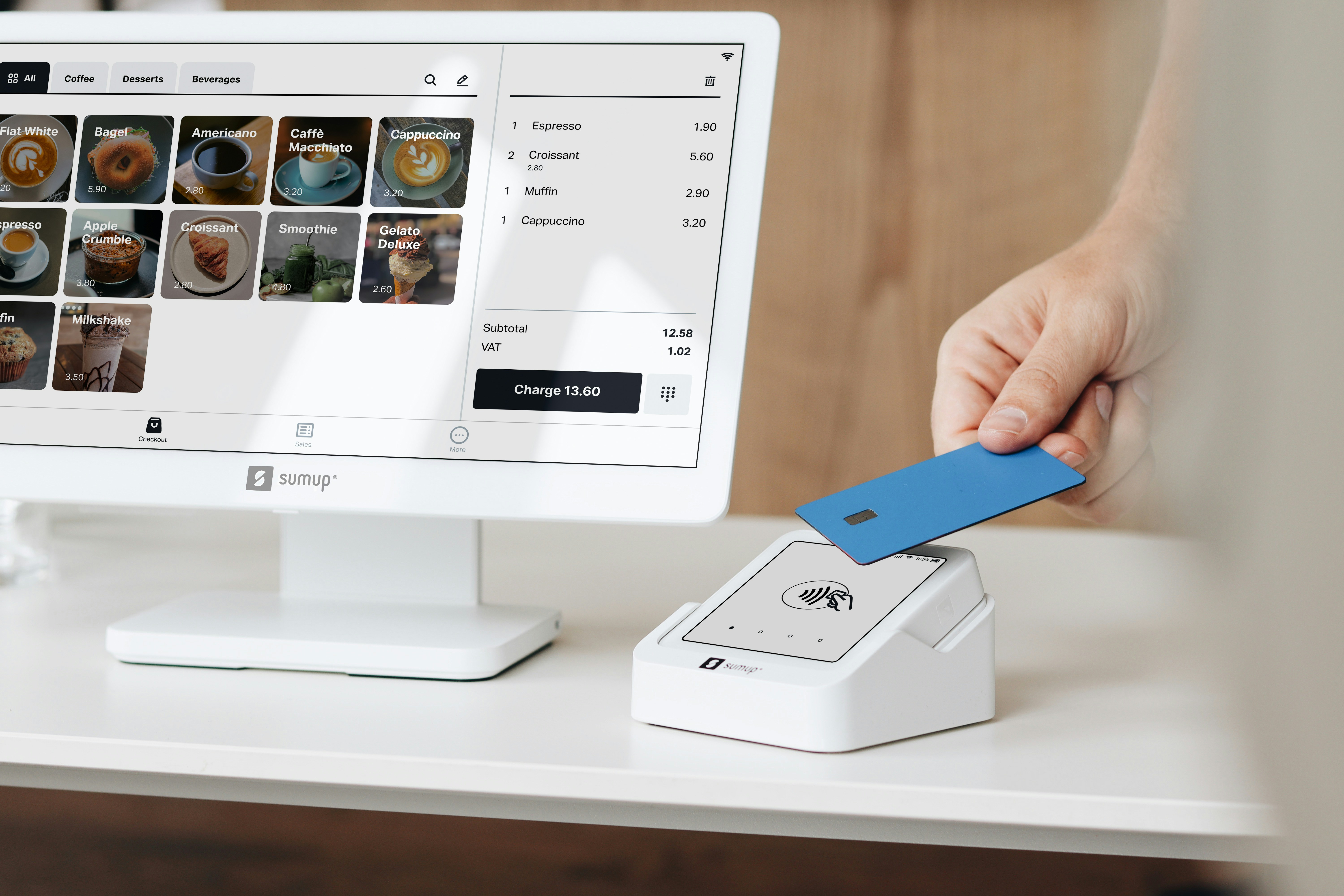 A person holding a blue card in front of a computer photo – Free ...