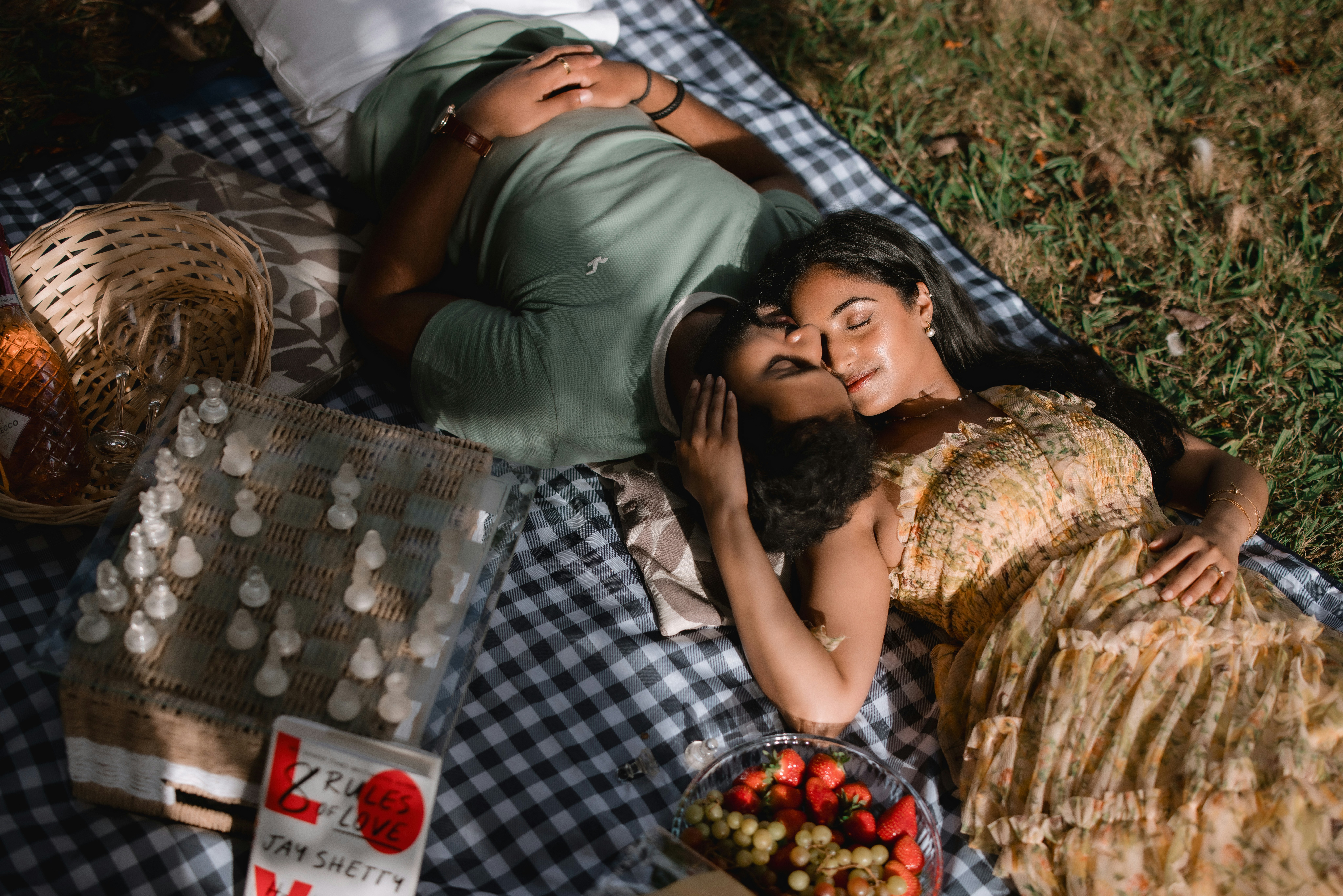 A man and a woman laying on a picnic blanket photo – Free Human Image ...