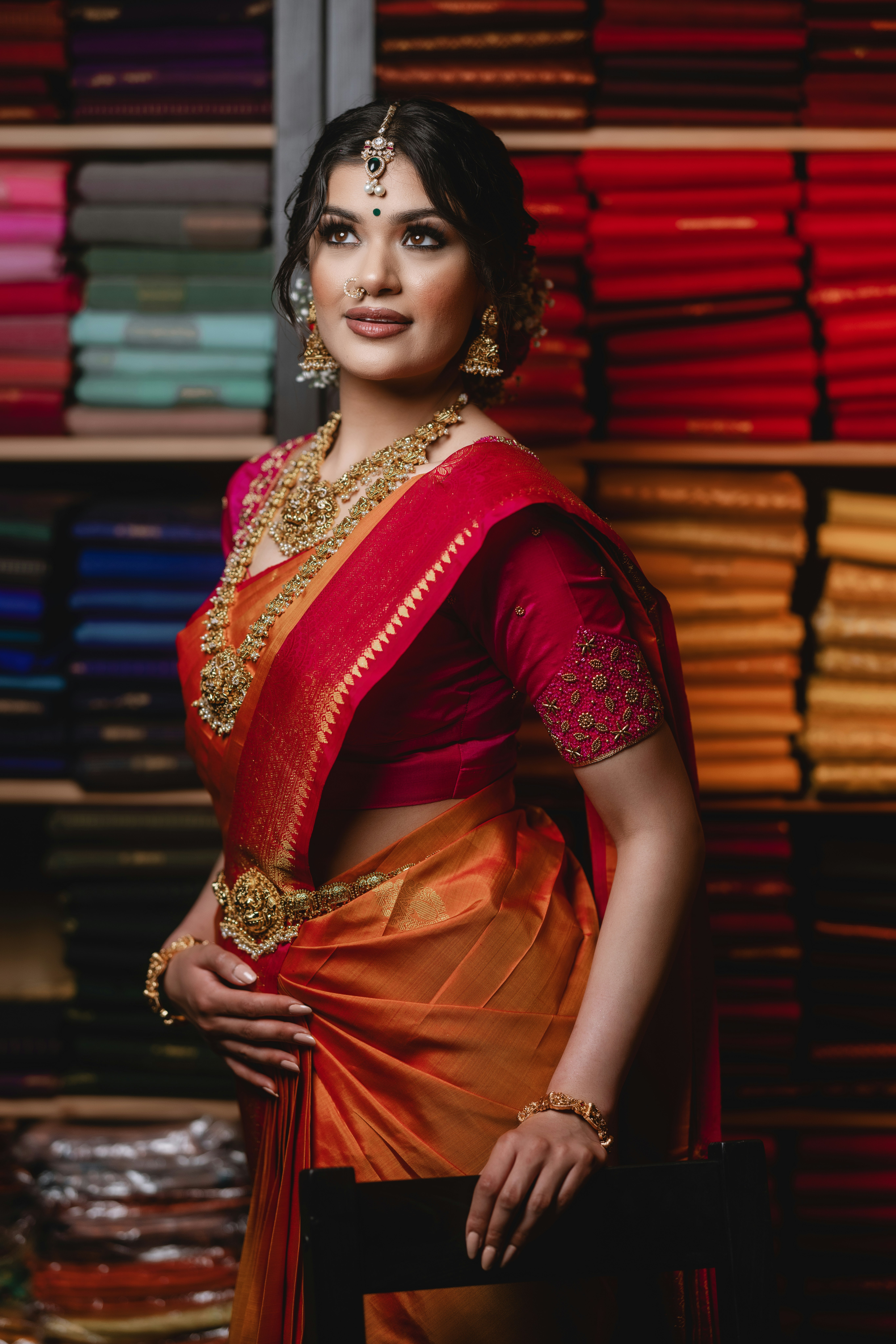 A woman in a red and orange sari photo – Free Standing Image on Unsplash