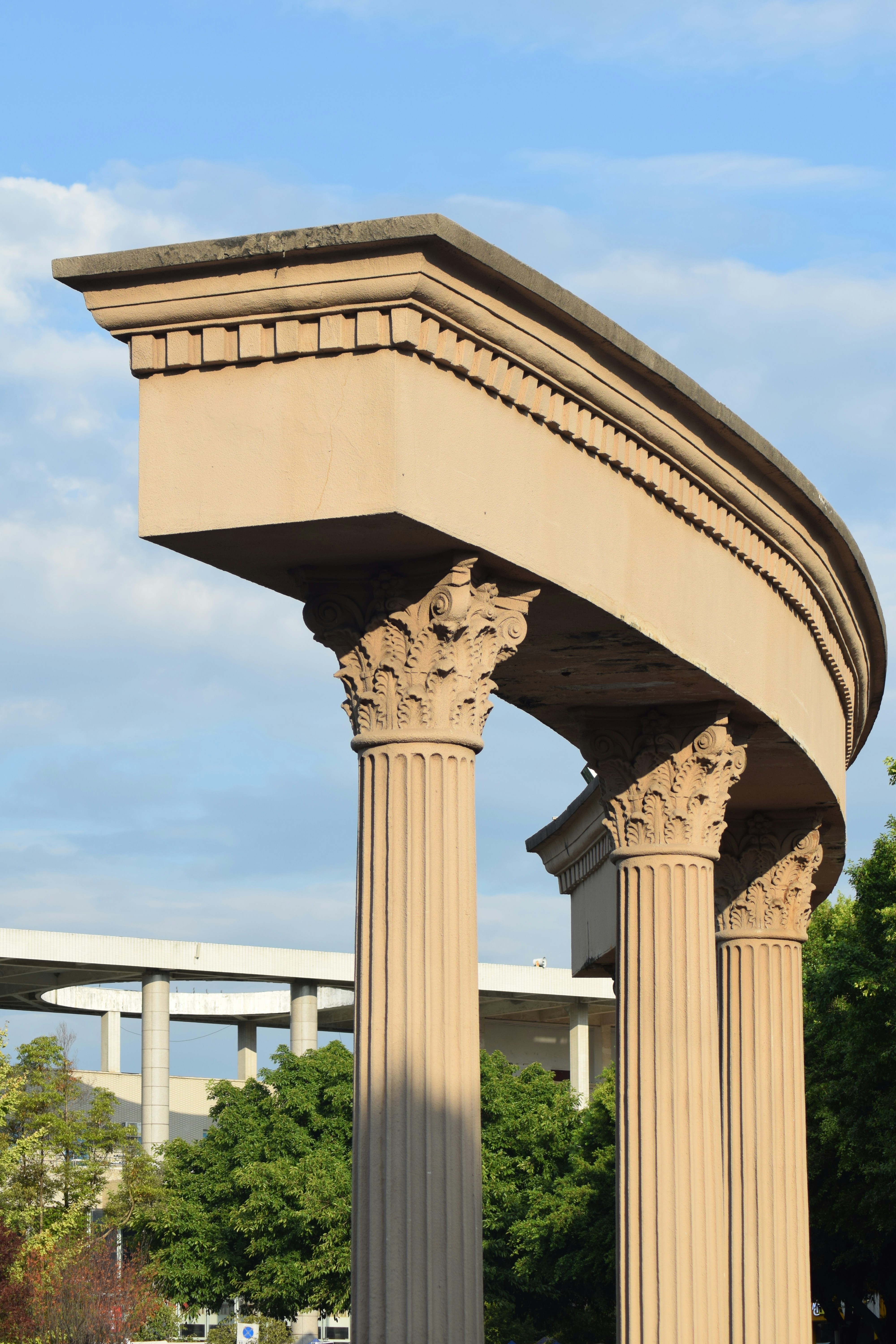 Arc of Stone: Skyward Curve Resting on Classical Columns