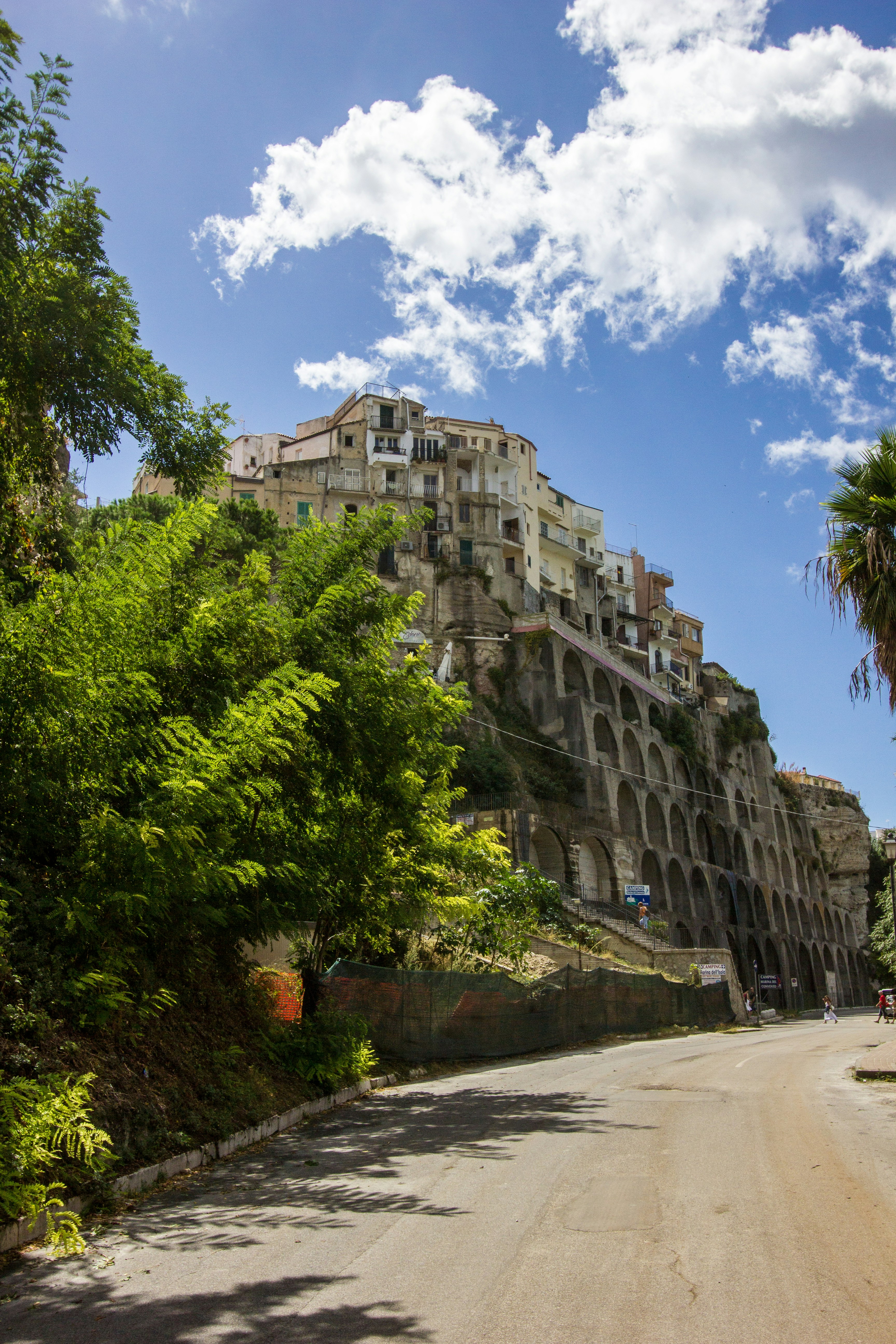 Viaduct Village: Homes Clinging to the Cliff Above a Winding Road