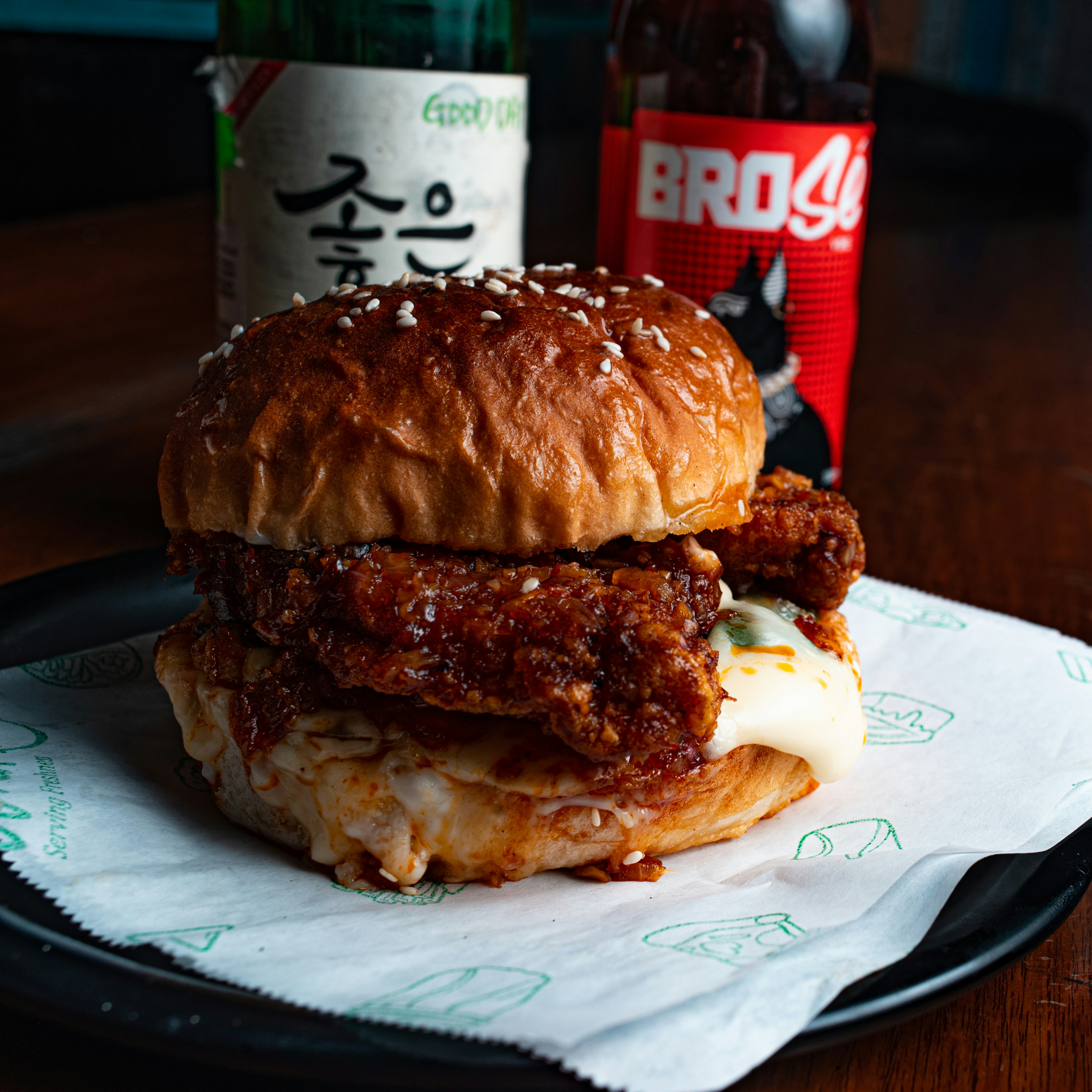 A sandwich on a plate next to a bottle of beer photo – Free Cdc - cafe ...