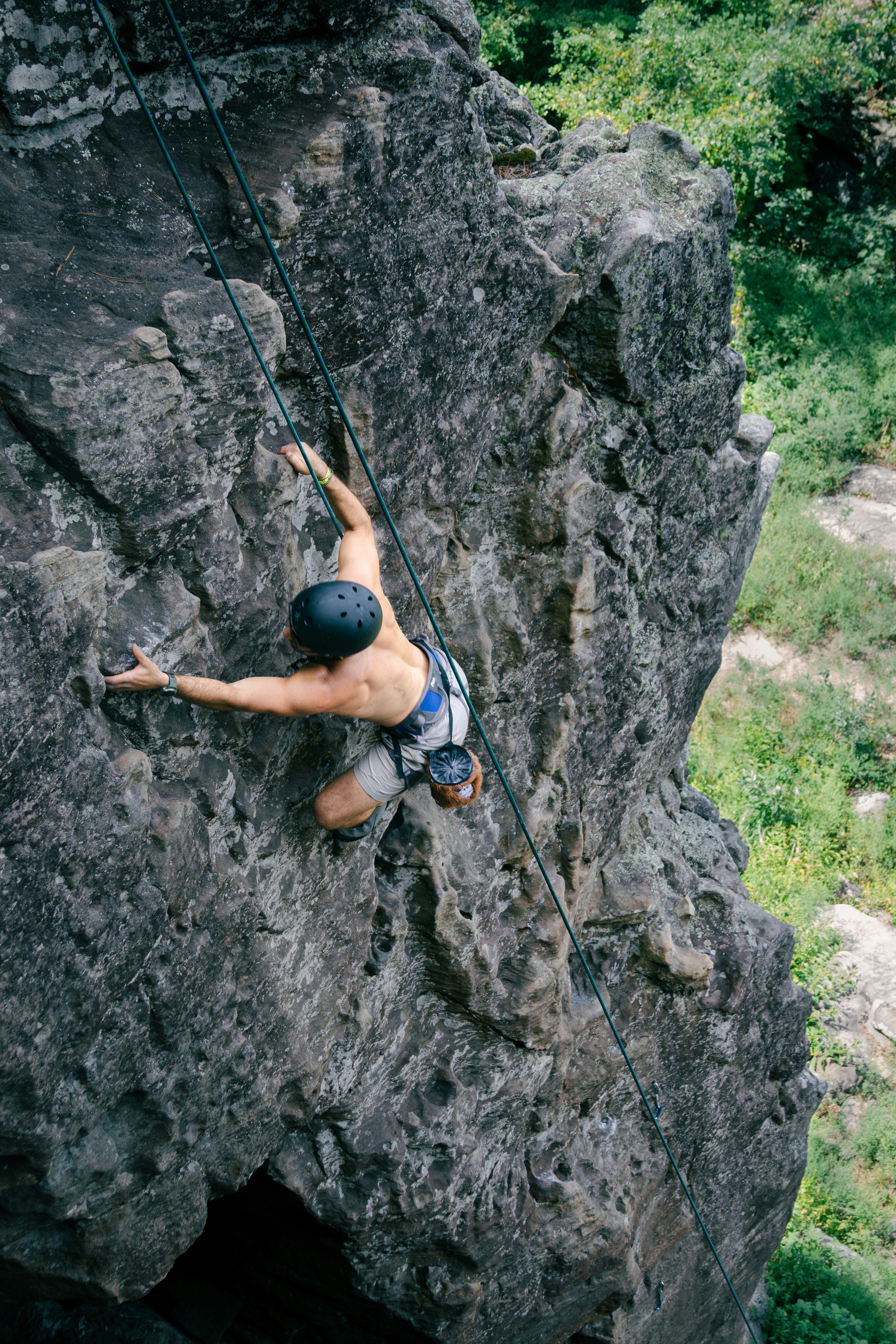 A man climbing up the side of a mountain photo – Free Horseshoe canyon ...