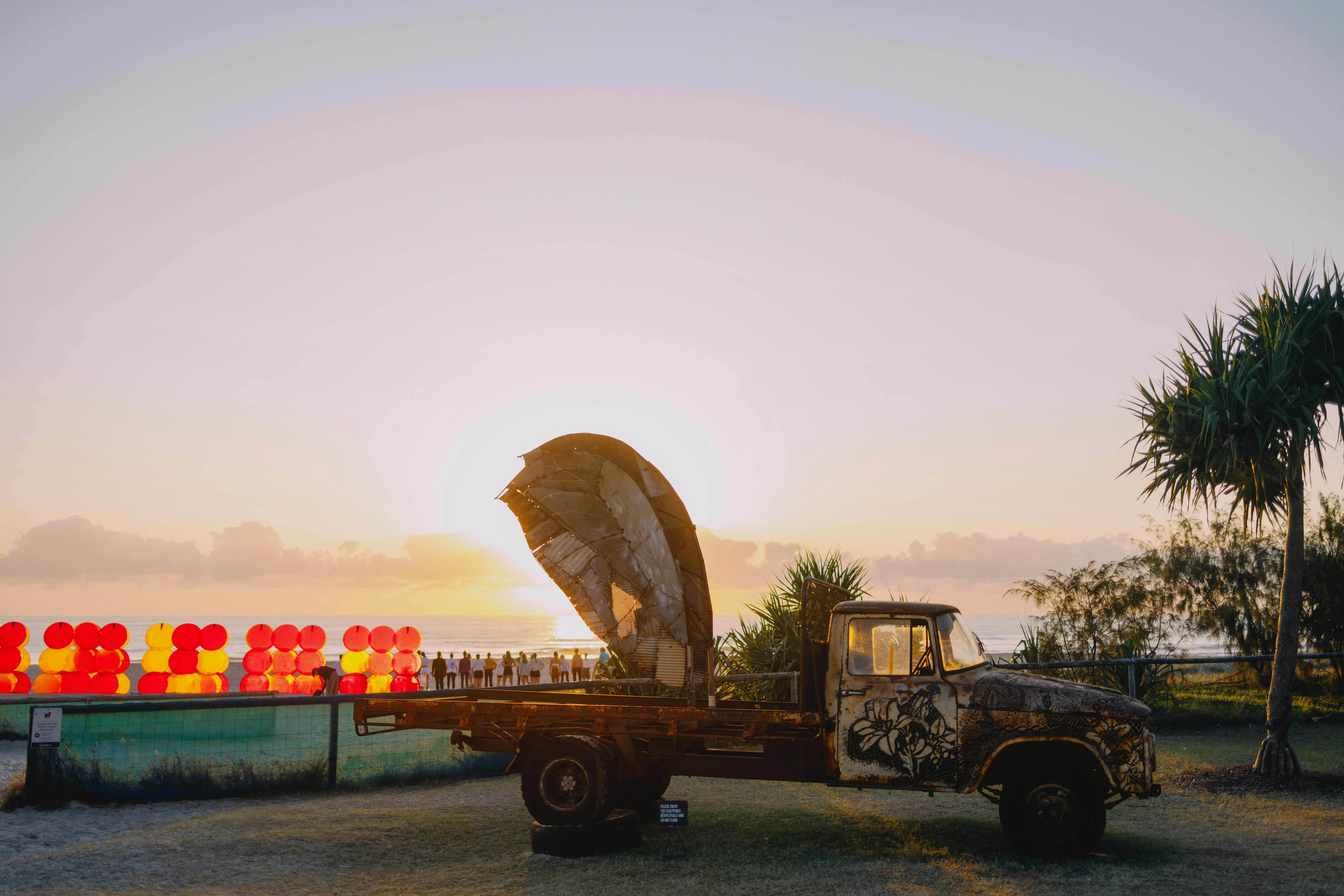 Sun-kissed Dunes and a Weathered Tie-Front Truck by the Sea