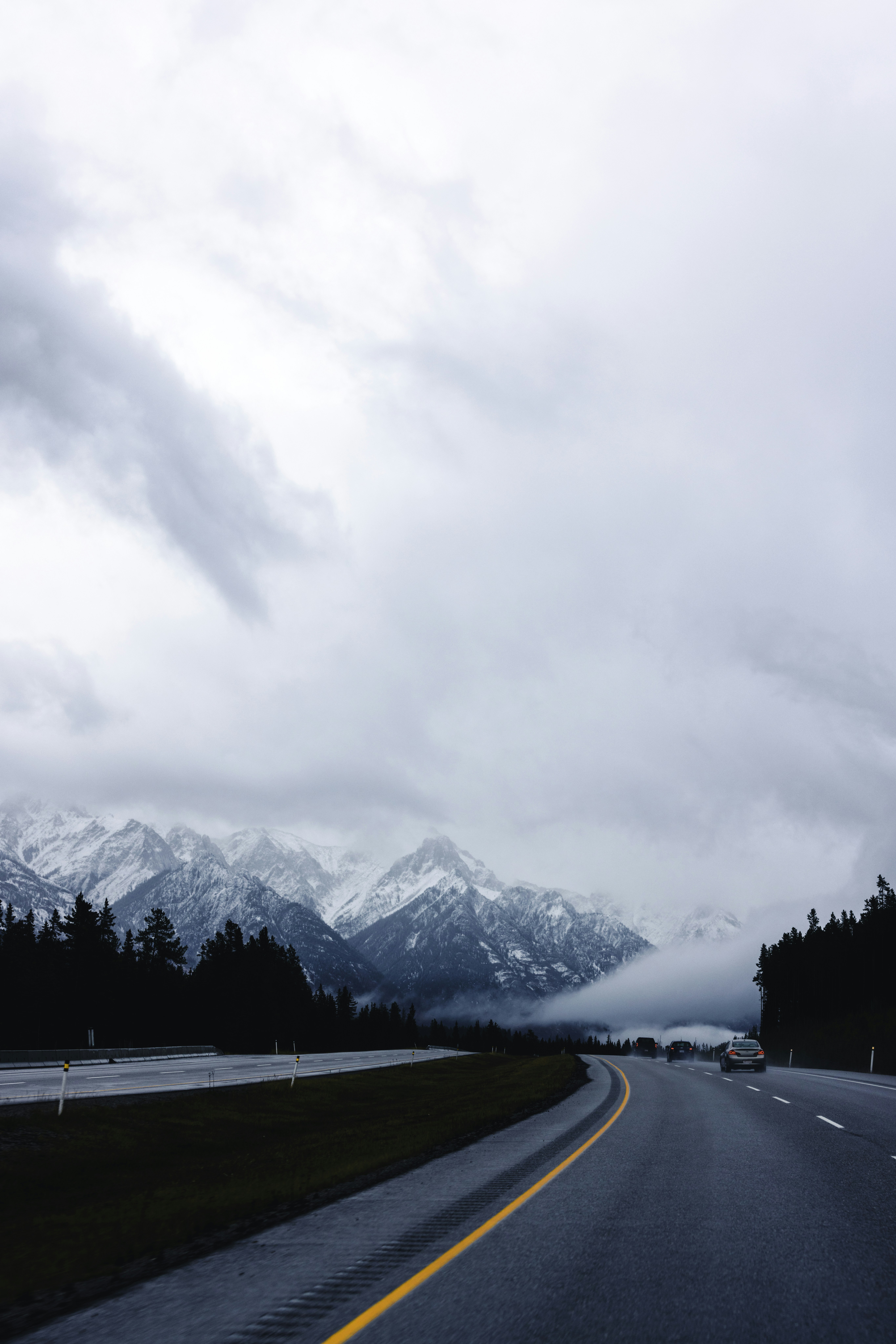 Open Road into Snow-Capped Vistas