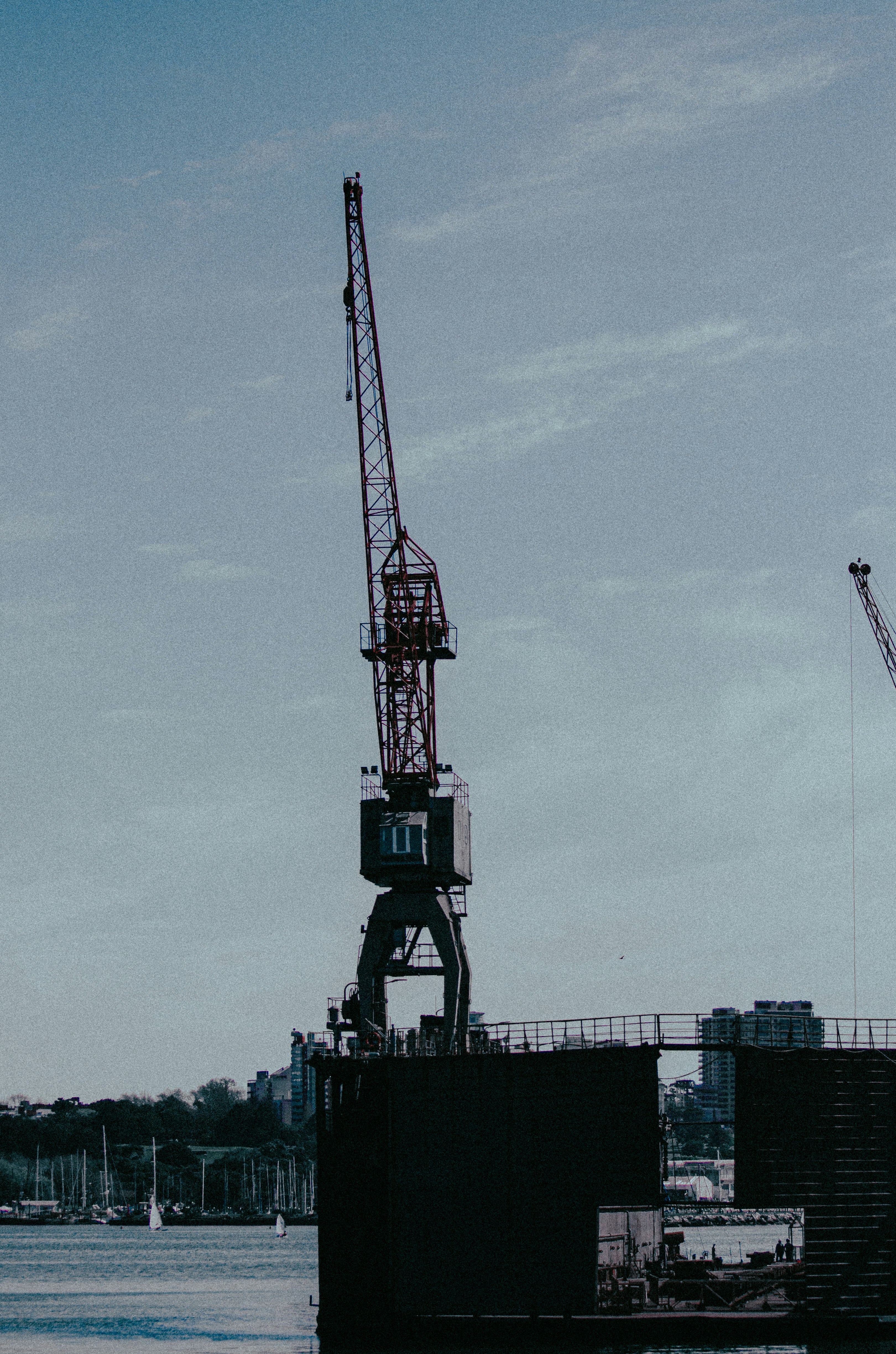 Harbor Crane Standing Sentinel Over Quiet Waters