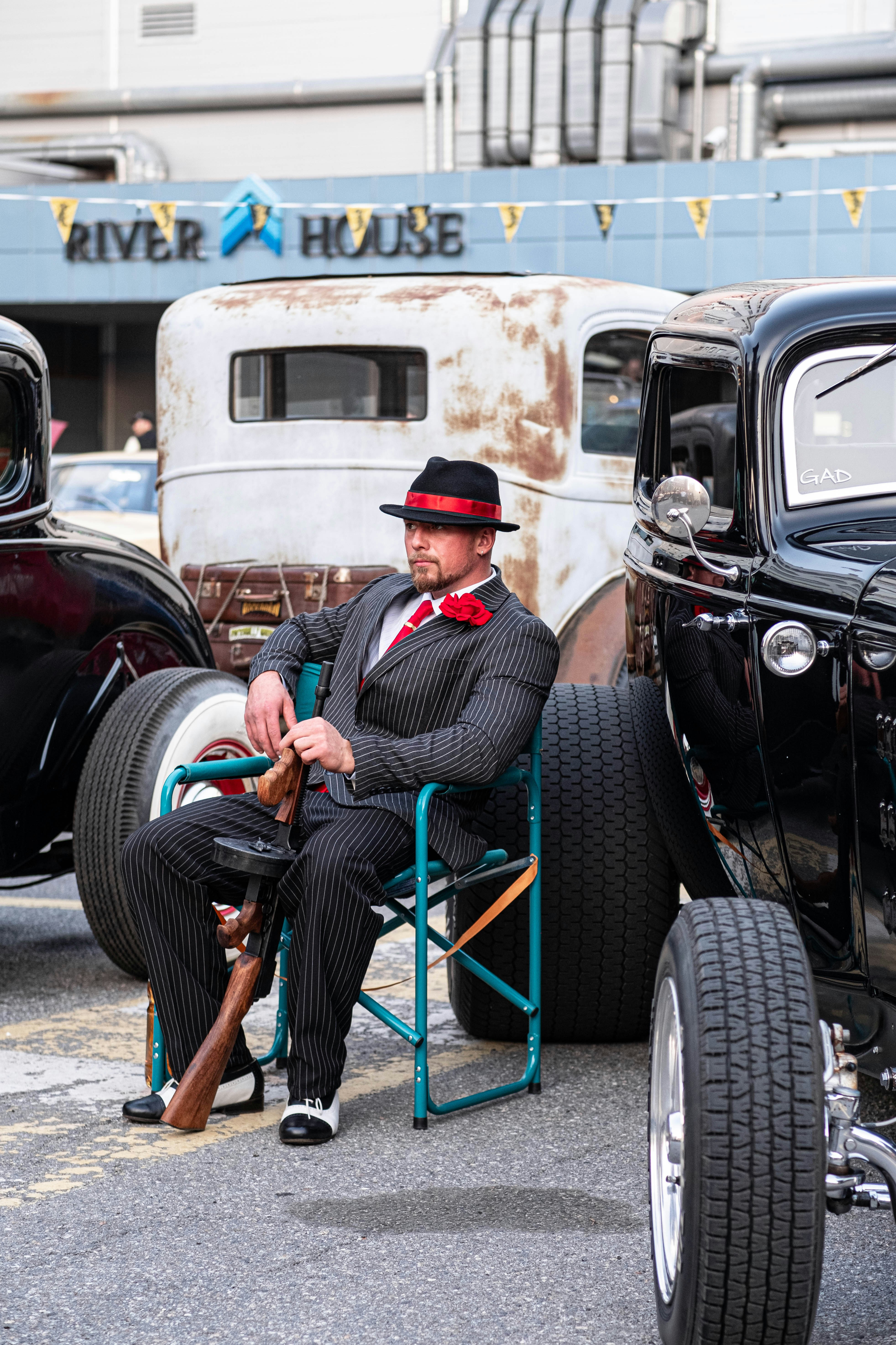 Pinstripe Gentleman Among Vintage Chrome at the Car Show