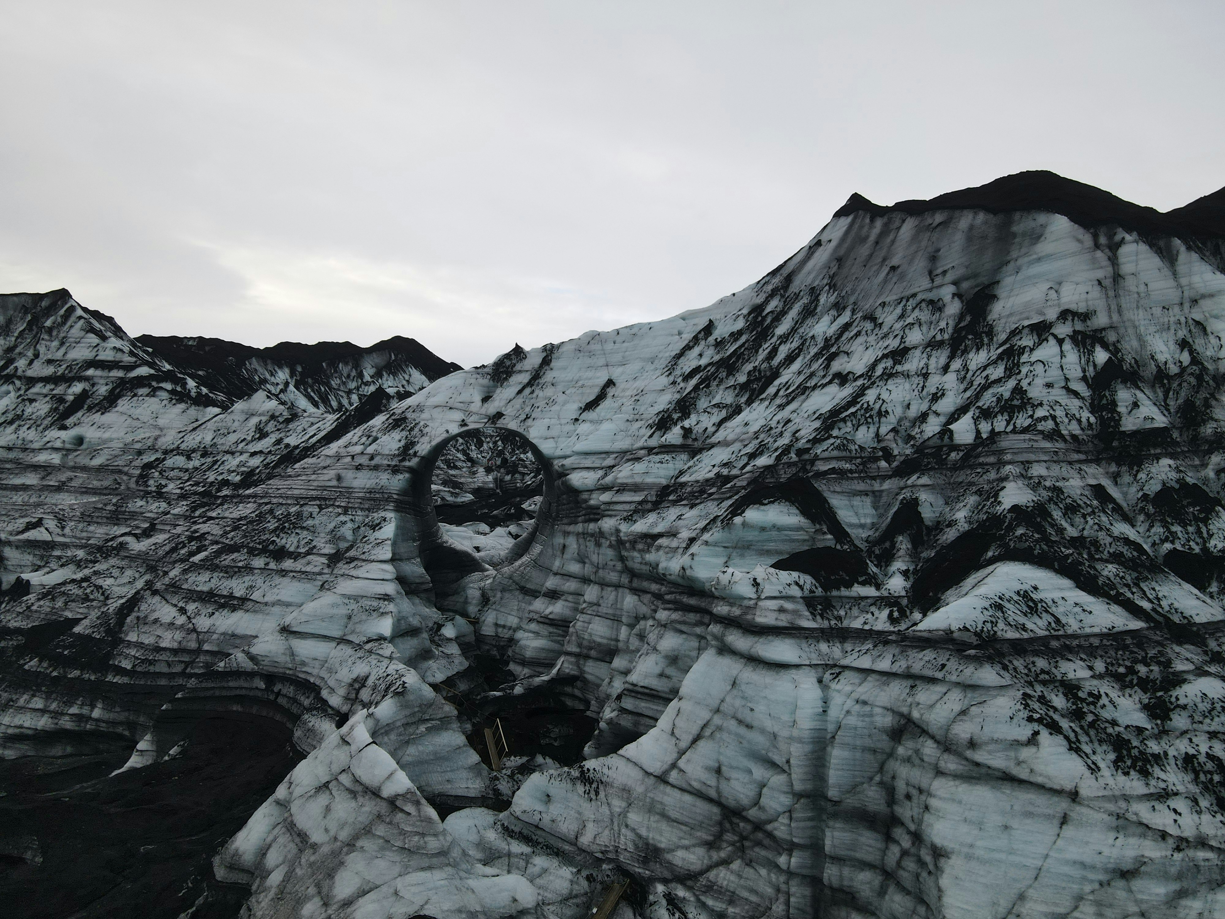 Ringed Gap in a Snow-veined Glacier Ridge
