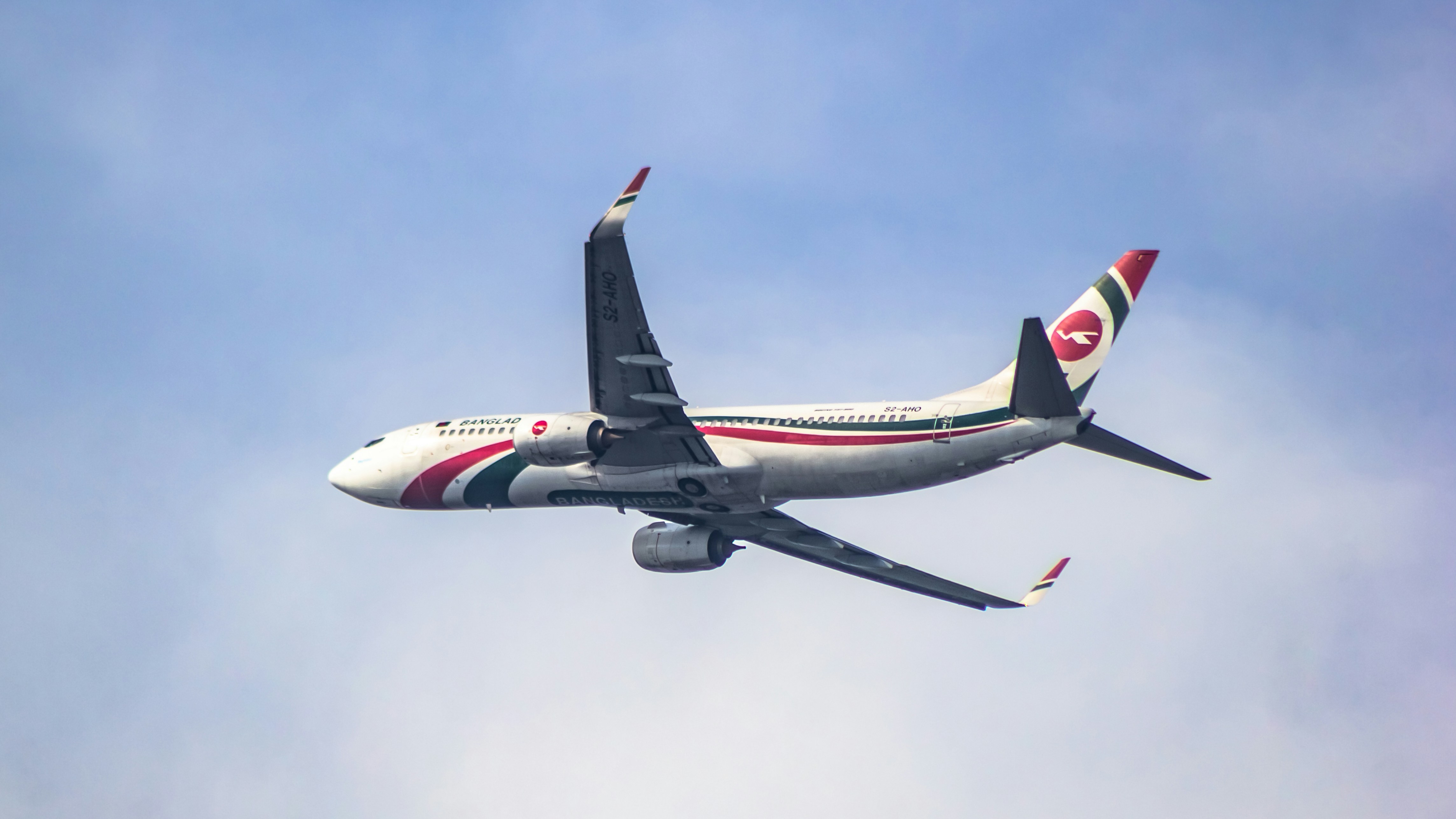A large jetliner flying through a blue sky photo – Free Takeoff Image ...