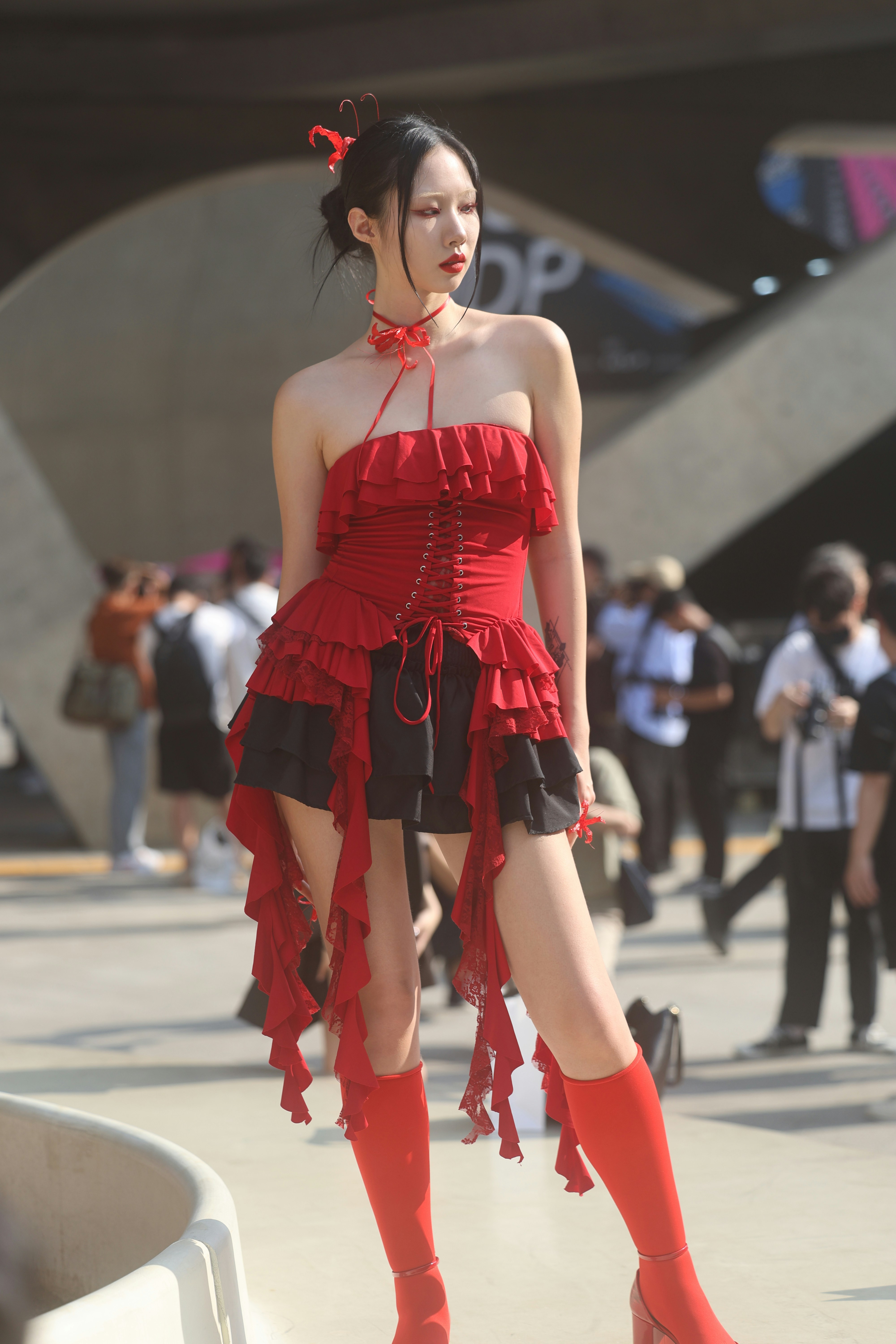 Crimson Corset Couture Amid the City Square