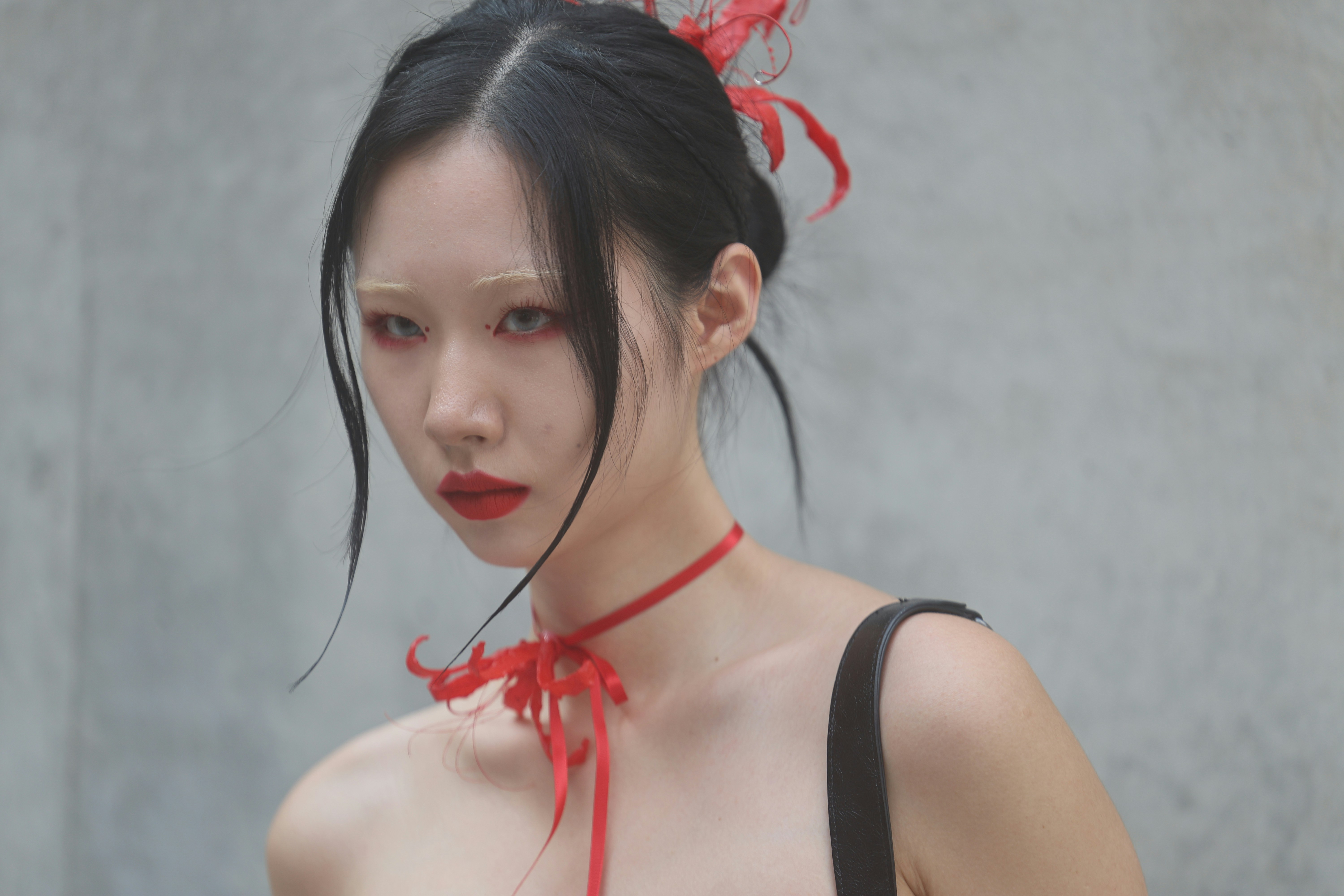 A woman with a red ribbon around her neck photo – Free Model Image on ...