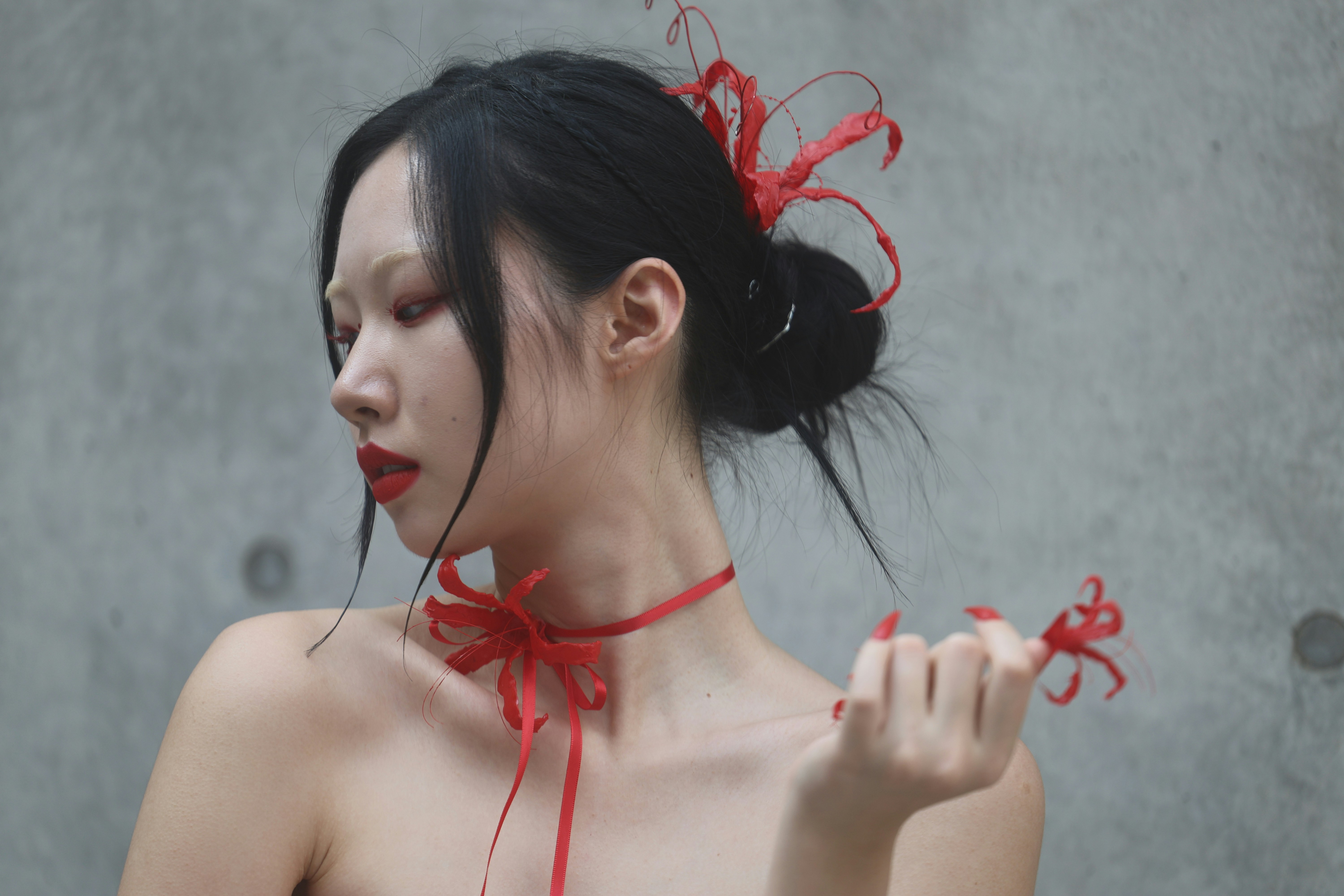 Crimson Elegance Against Concrete