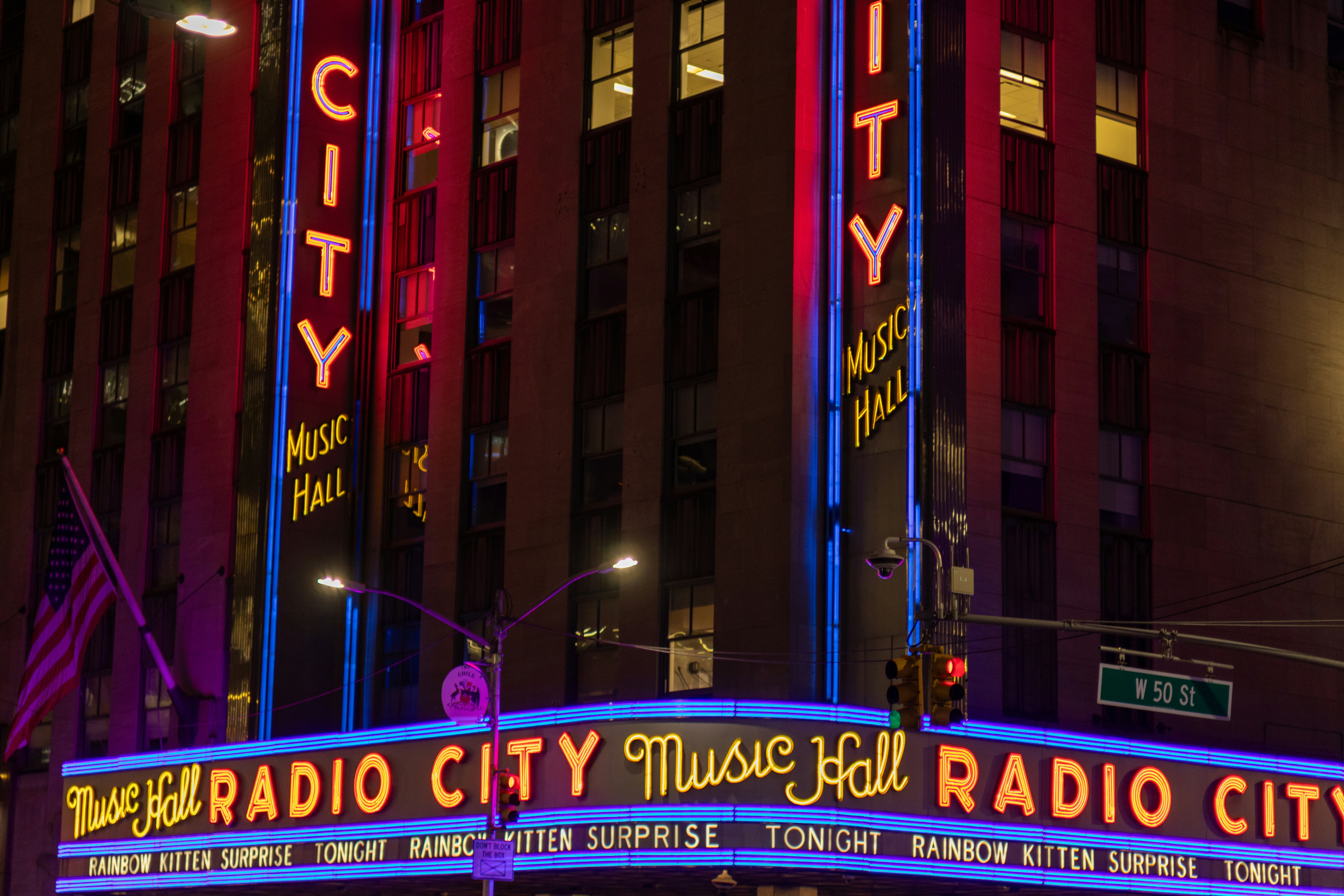 The radio city radio city sign lit up at night photo – Free Building ...