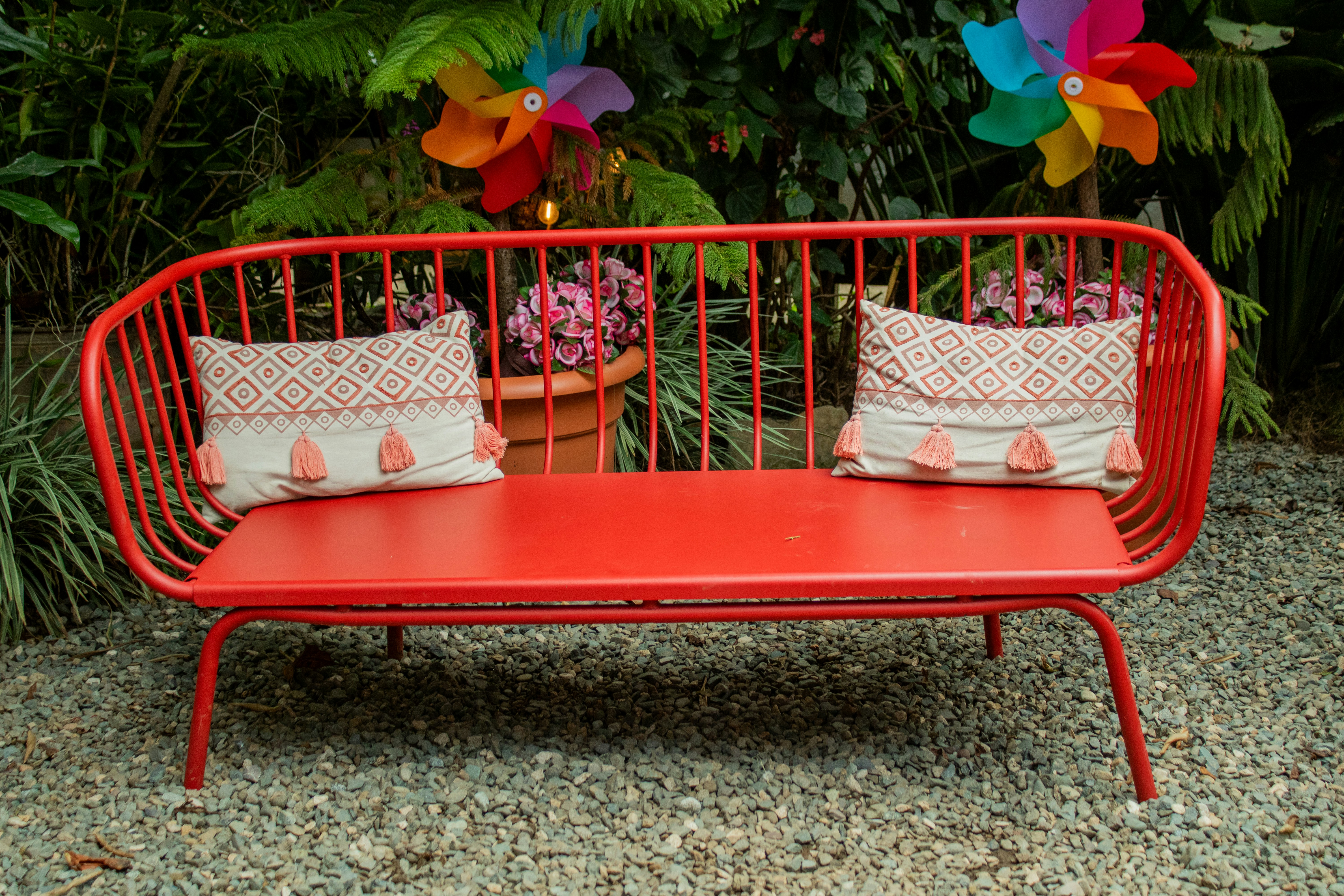 Crimson Bench in a Colorful Oasis