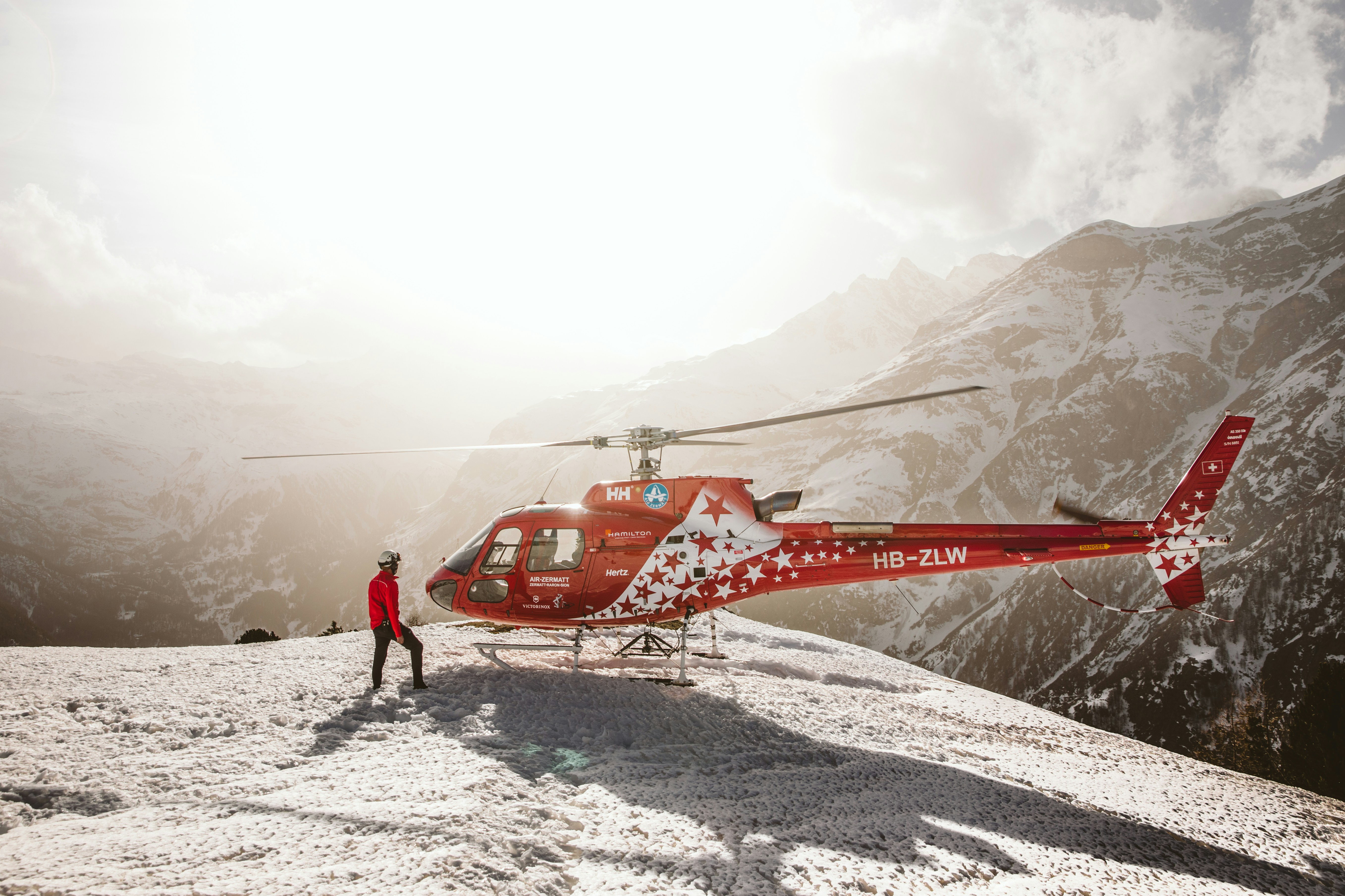 Crimson Rescue on the Alpine Crest at Dawn
