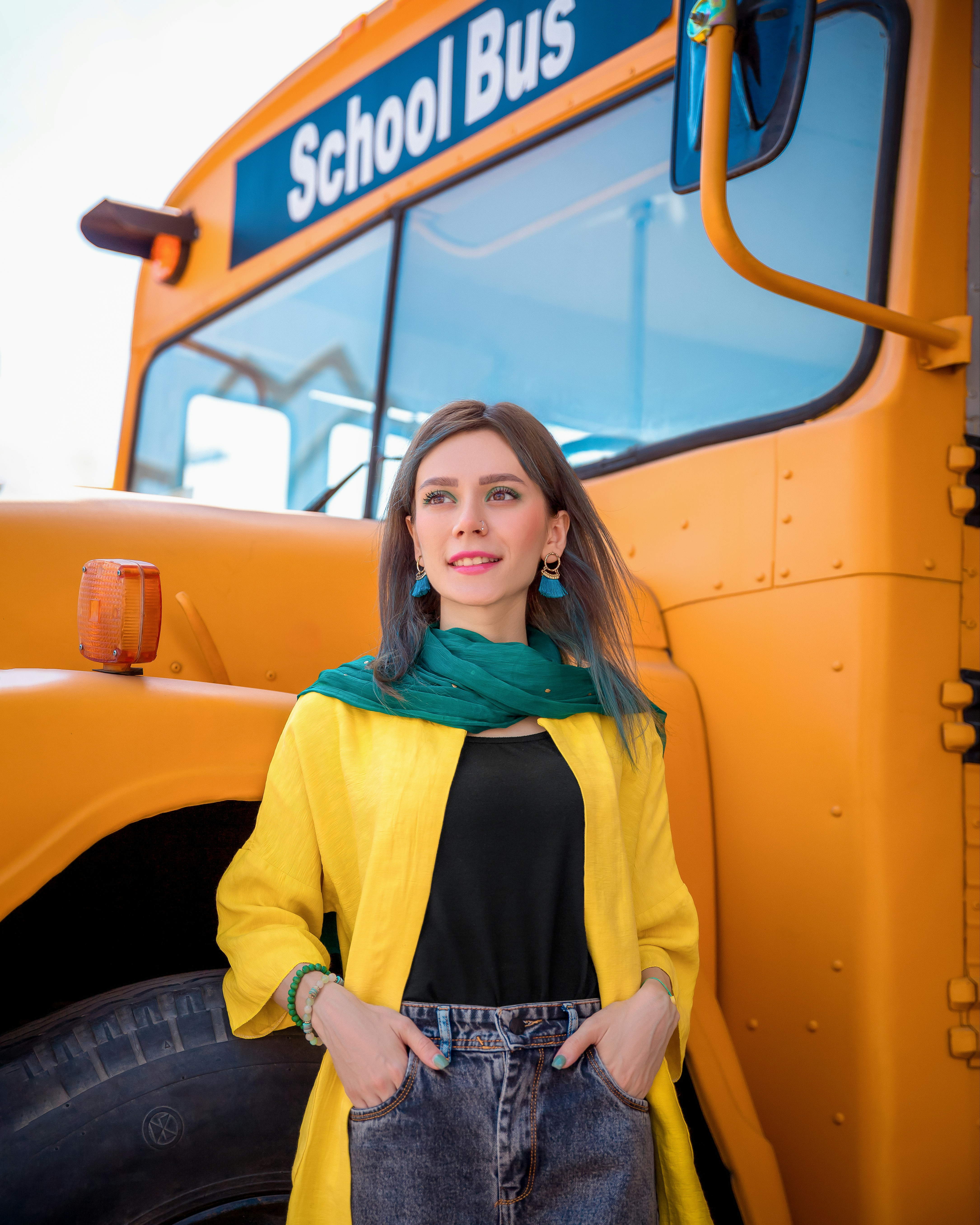 Sunlit Confidence: Portrait in Yellow by the School Bus