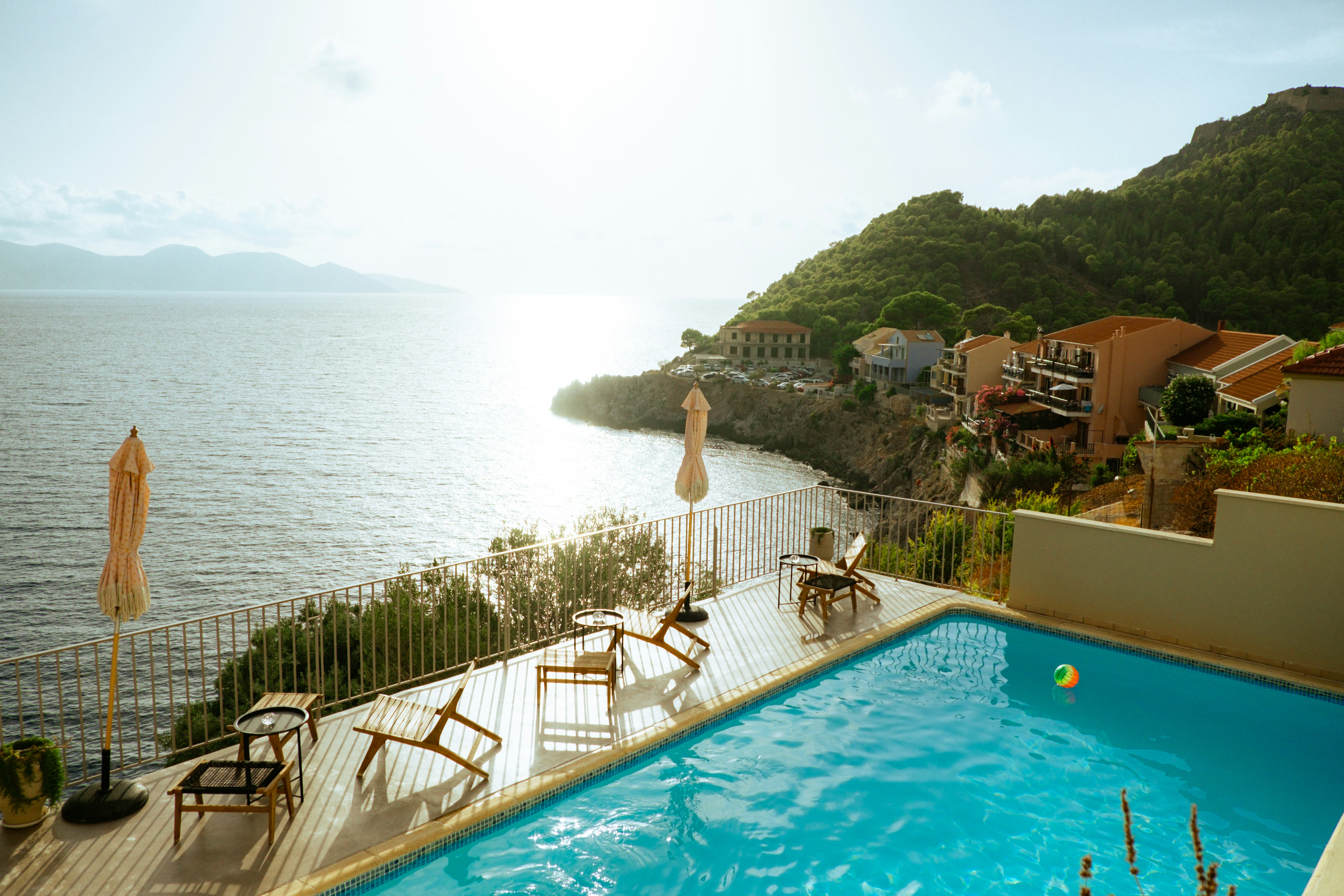 A large swimming pool next to the ocean photo – Free Light Image on ...