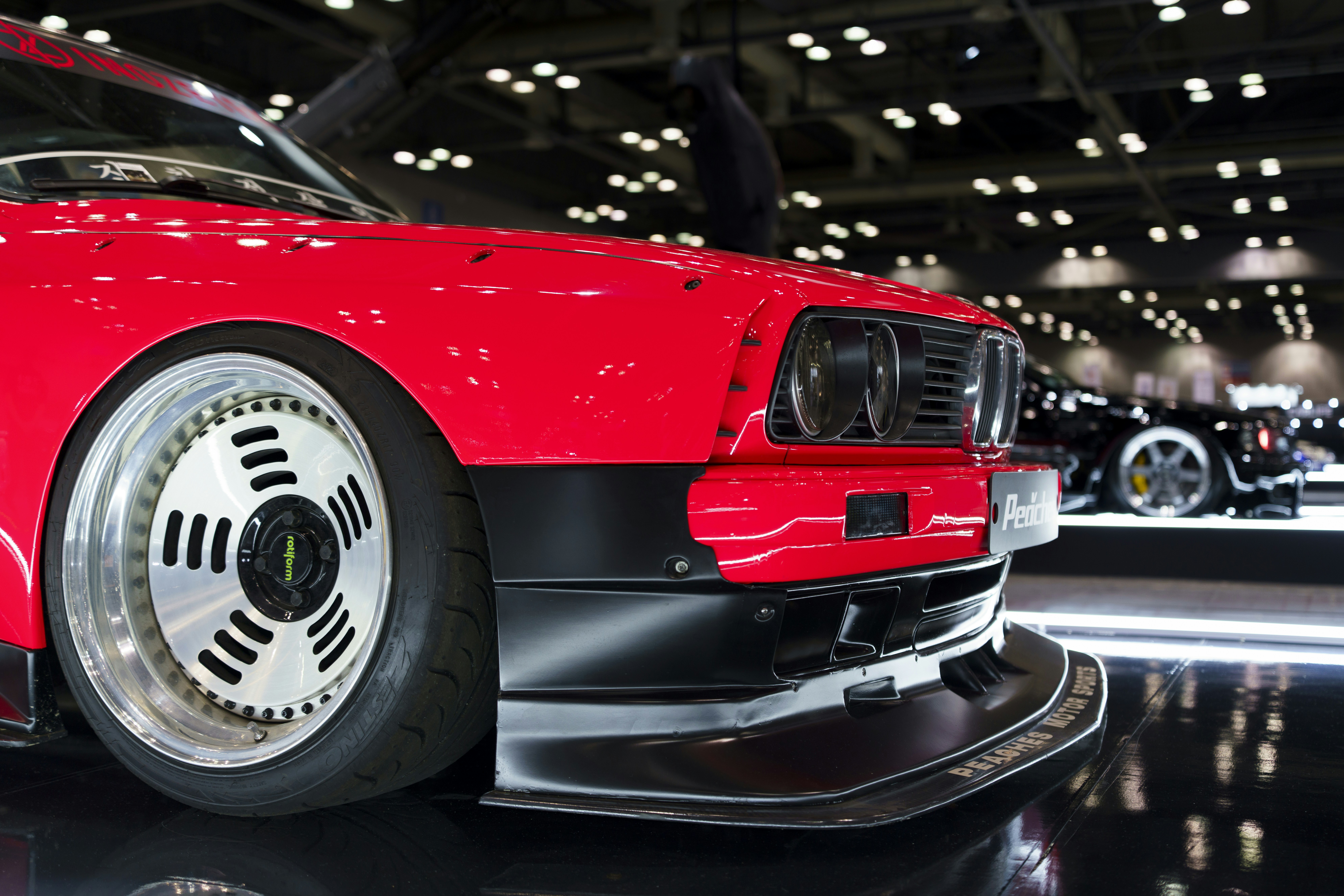 A red sports car on display at a car show photo – Free Car Image on ...
