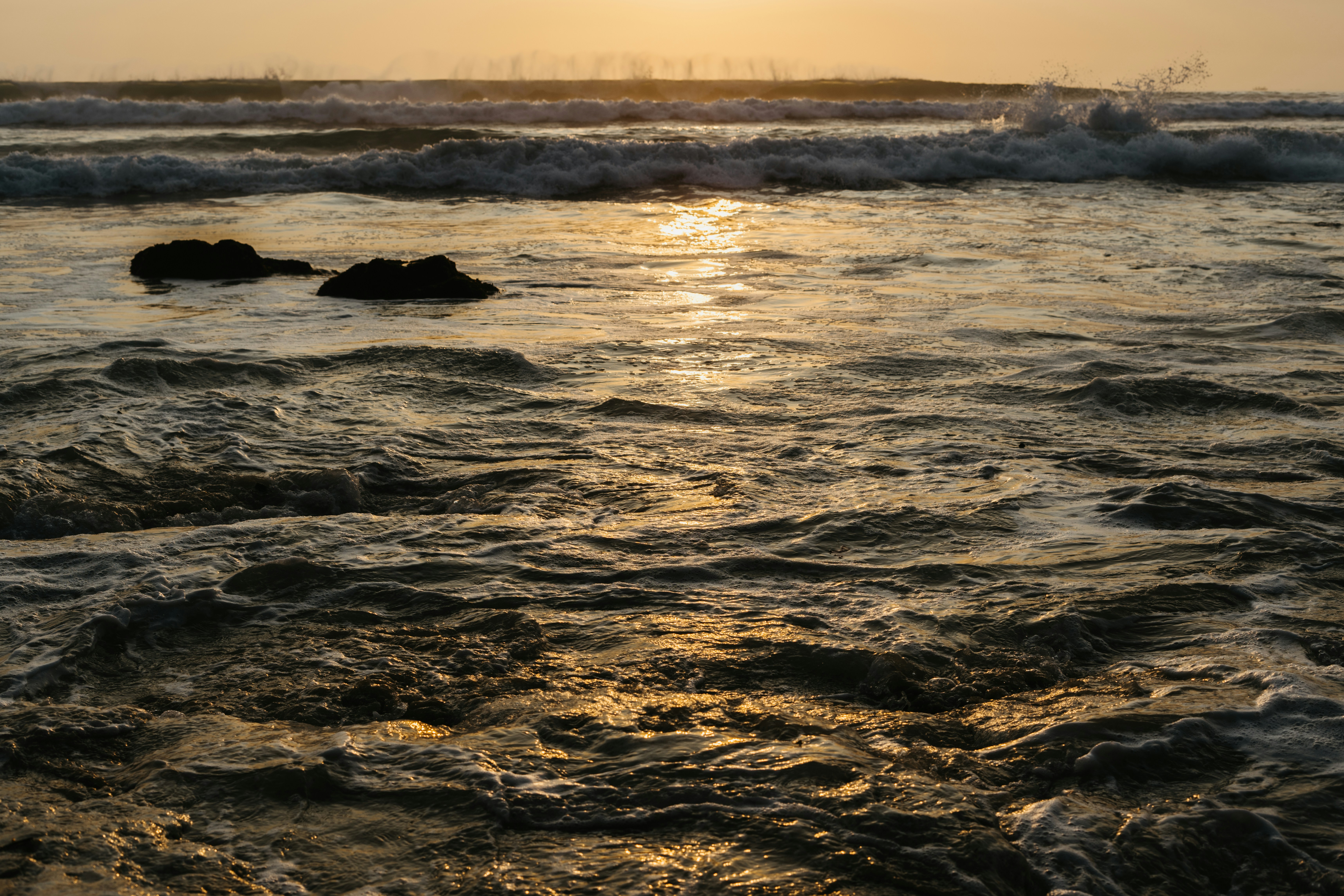 Glow at the Edge: Sunset Over a Rugged Seashore