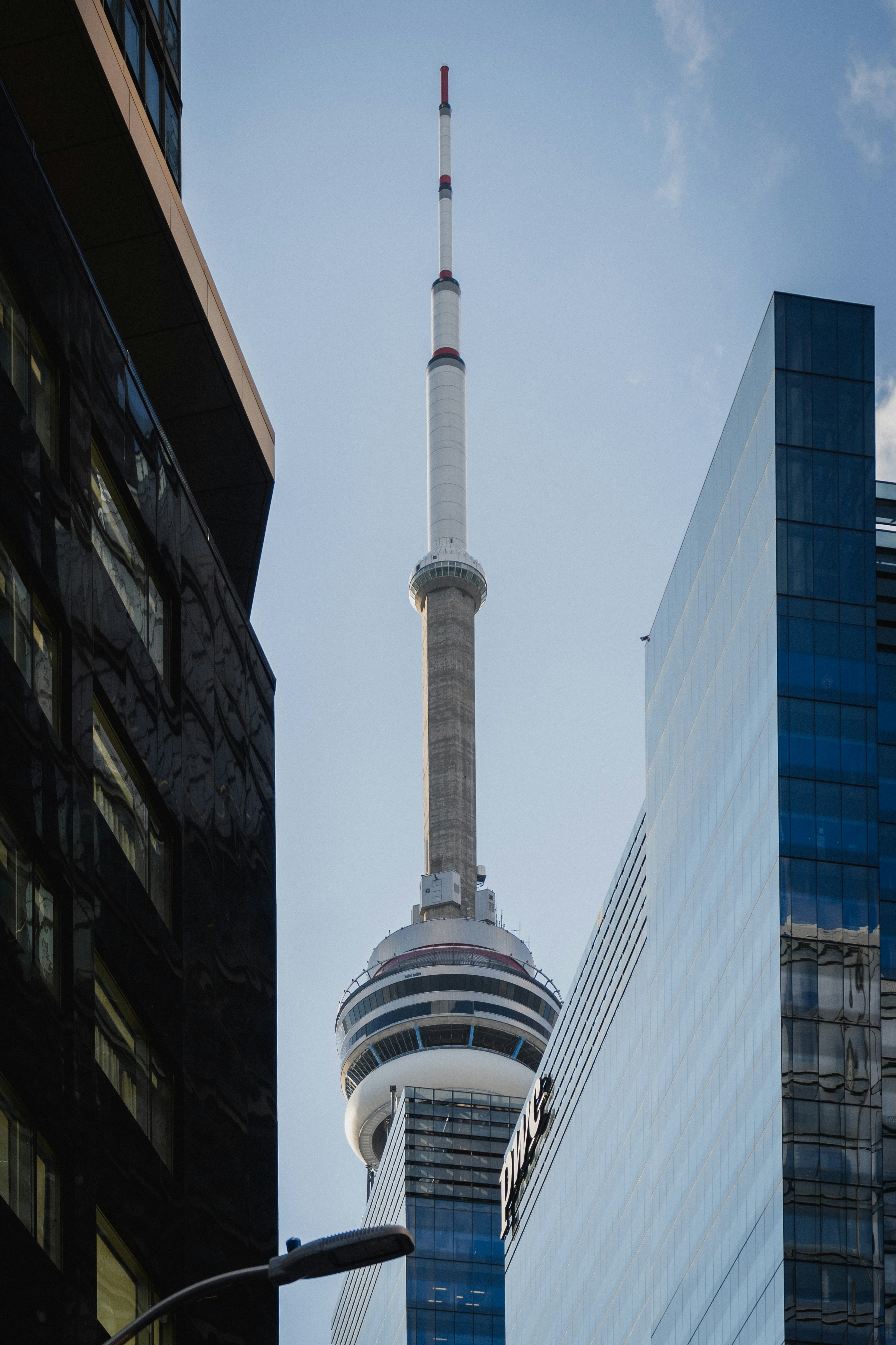 Tokyo's Skyward Needle Framed by Glass Giants