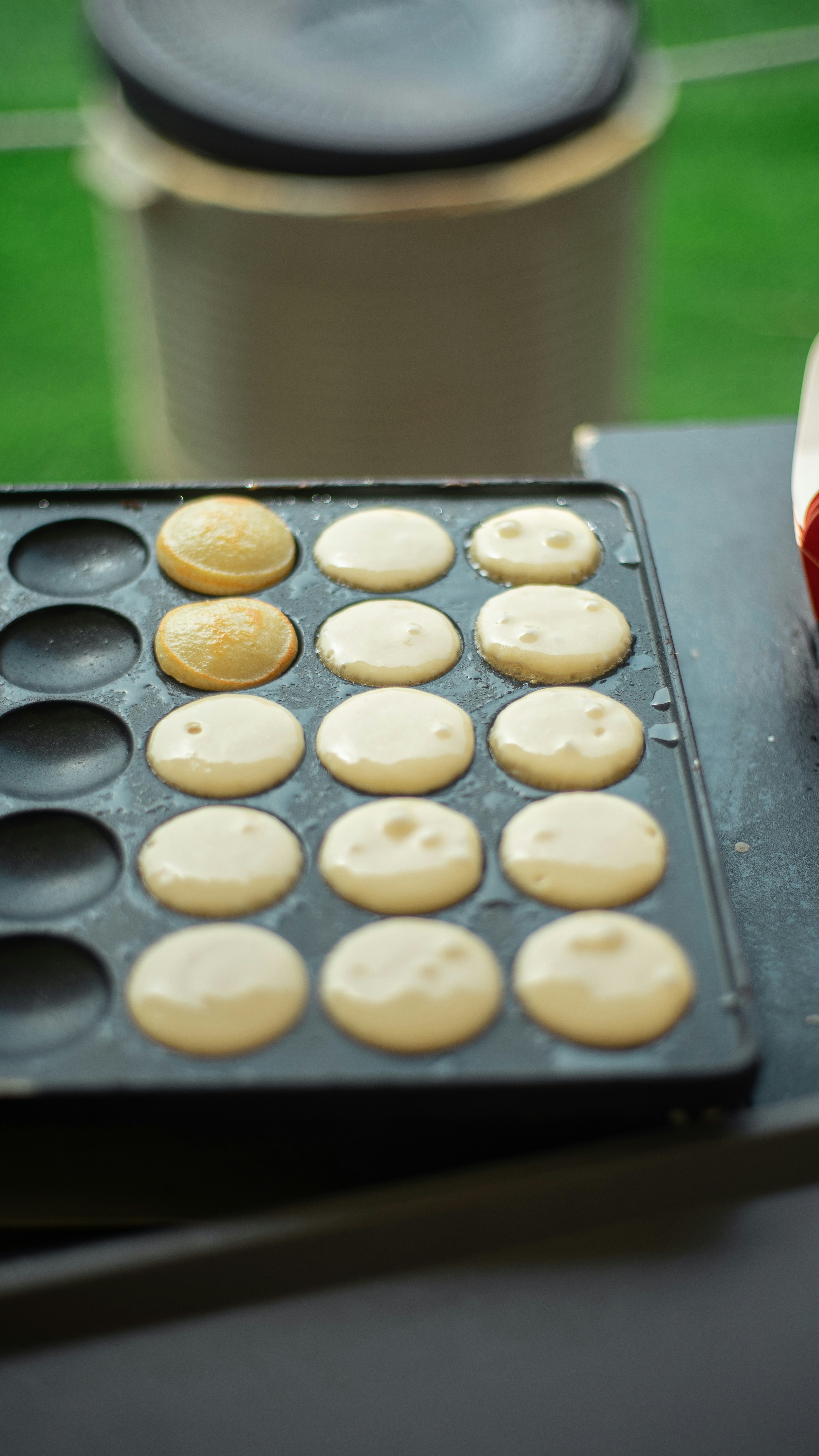 Round Batter Domes on a Nonstick Grill: A Close-up on Culinary Precision