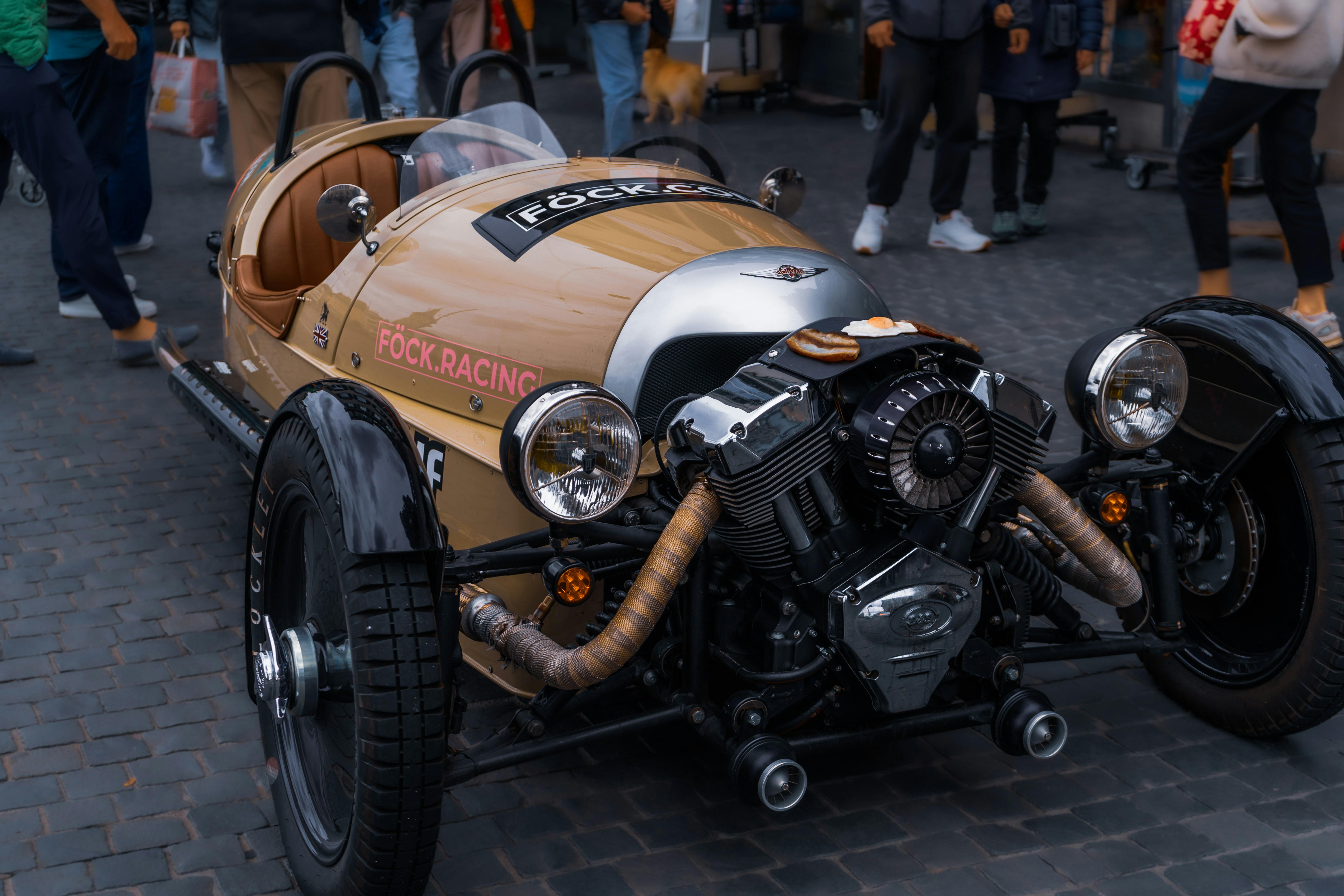 Copper-Toned Vintage Racer: Exposed Engine on Cobblestones