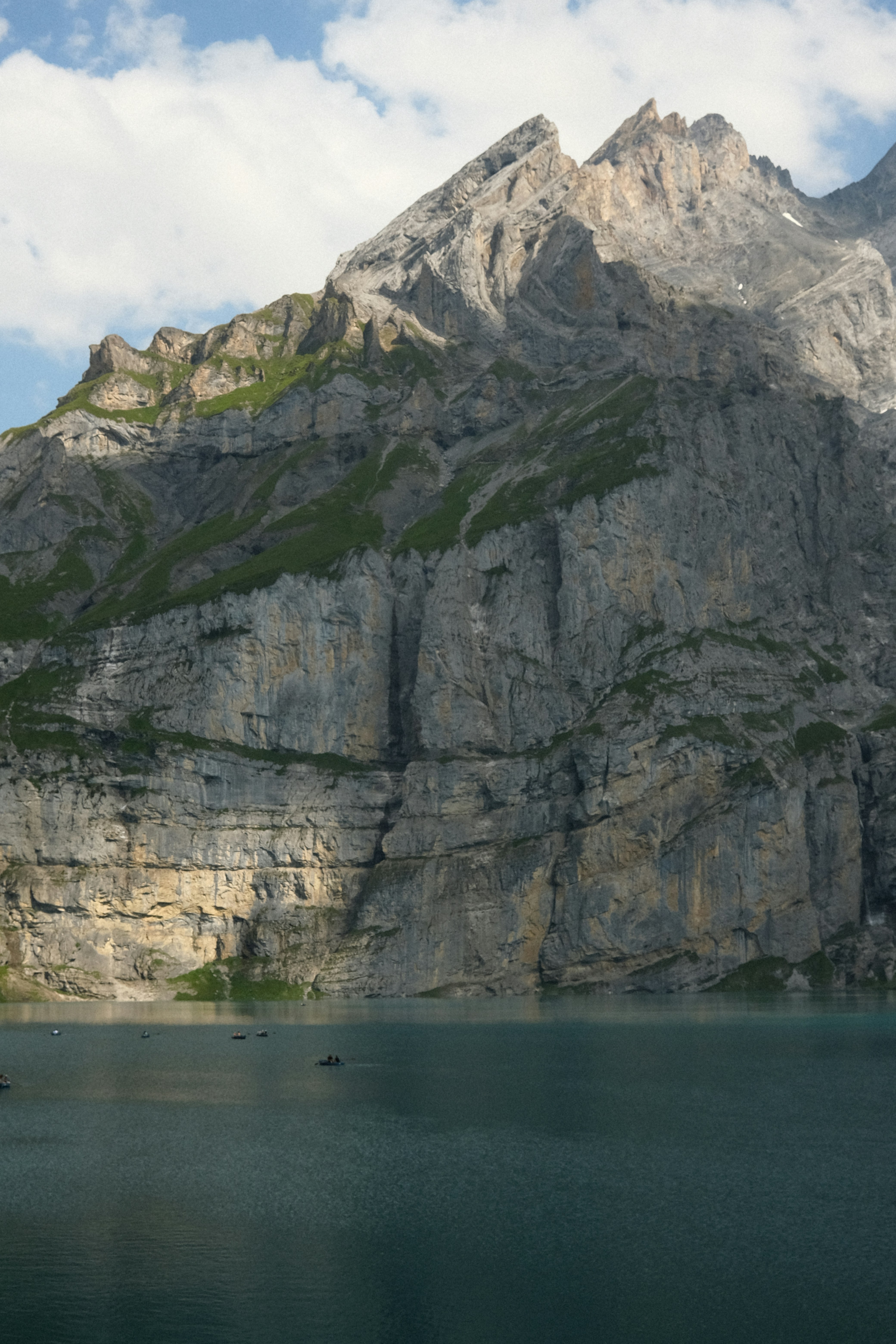 A large mountain with a lake in front of it