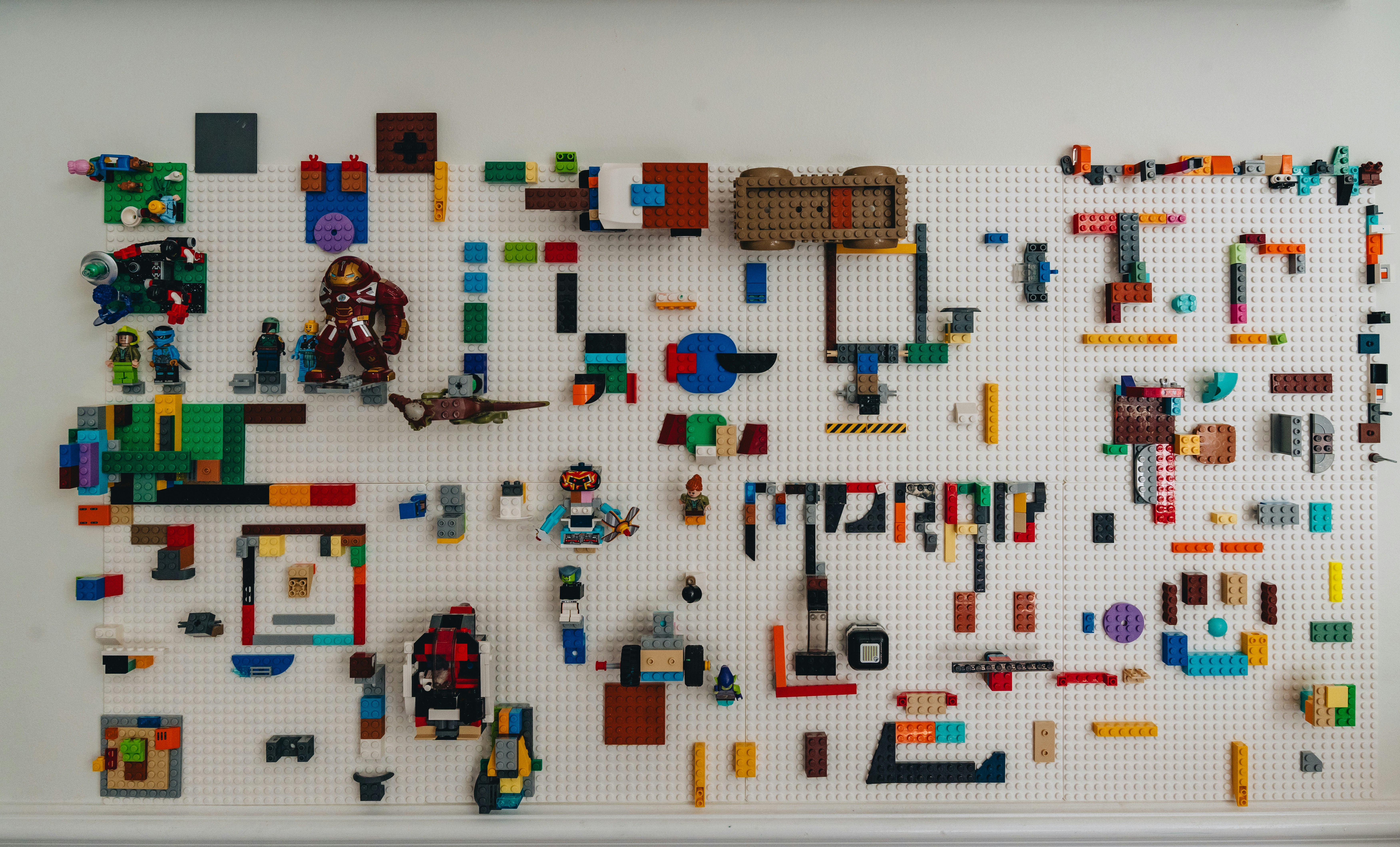 A white wall with a bunch of legos on it photo – Free Toy Image on Unsplash